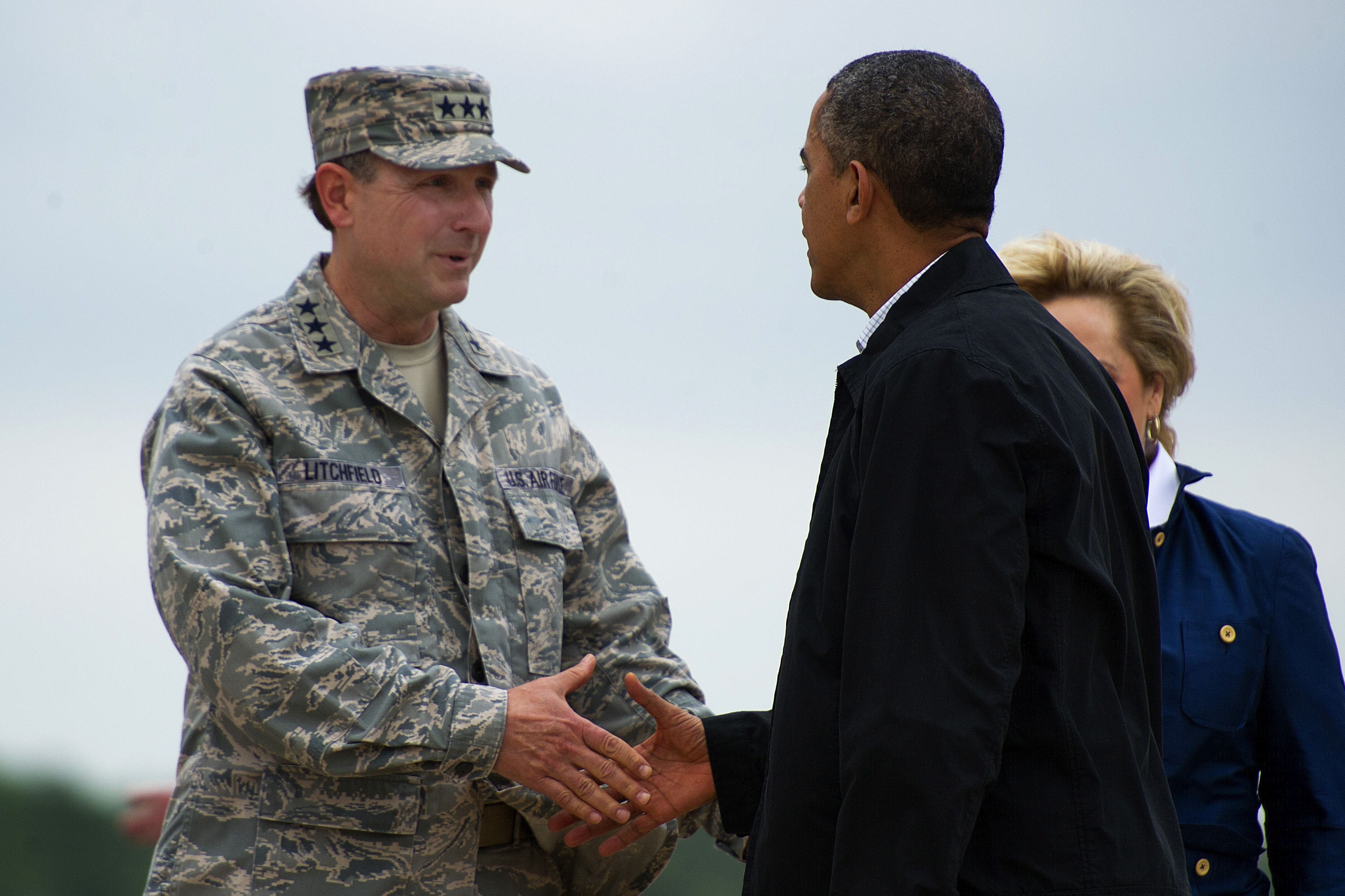 President Barack Obama is greeted by Air Force Lt. Gen. Bruce ...
