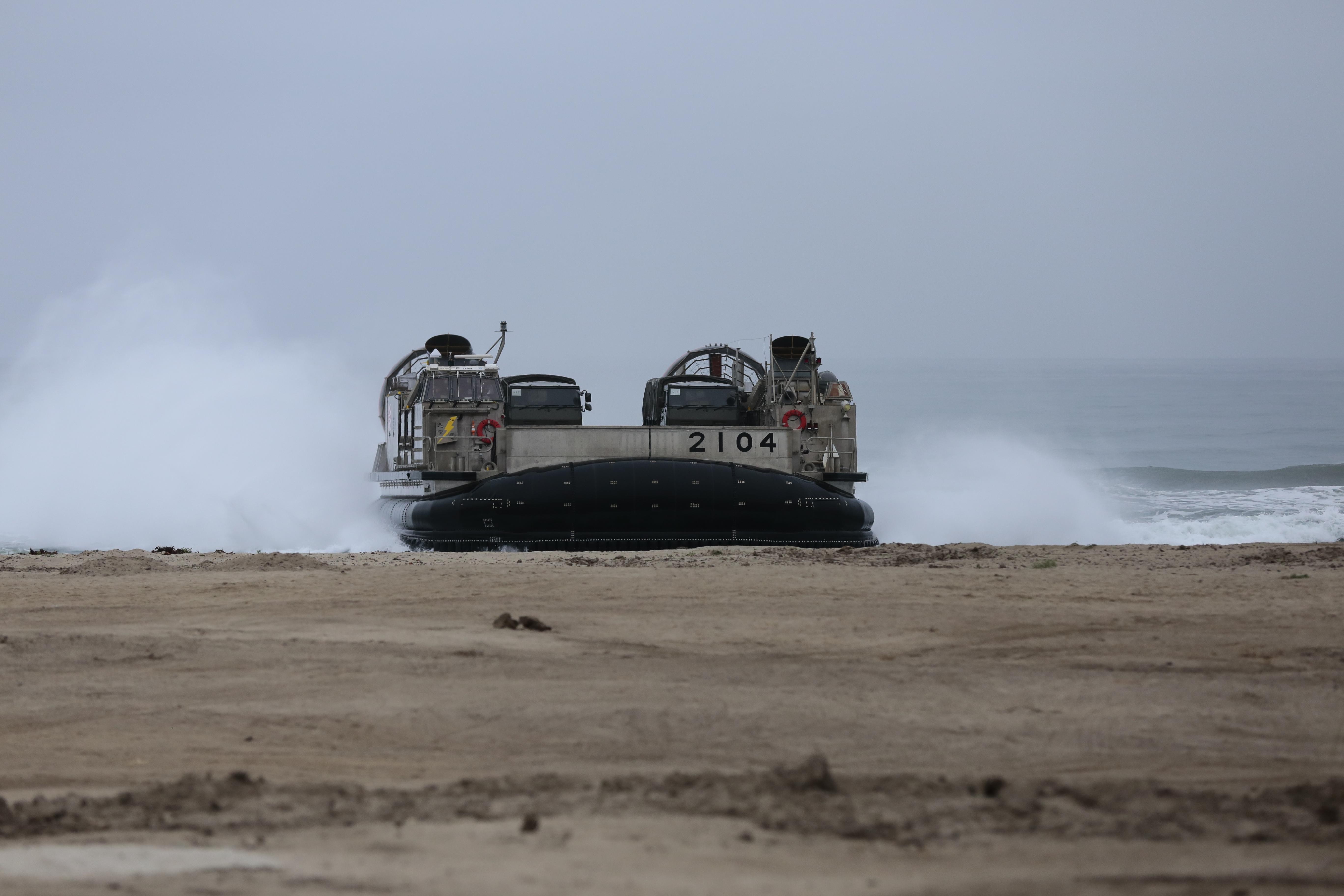 A Japanese landing craft air cushion (LCAC) lands on Red Beach as part ...