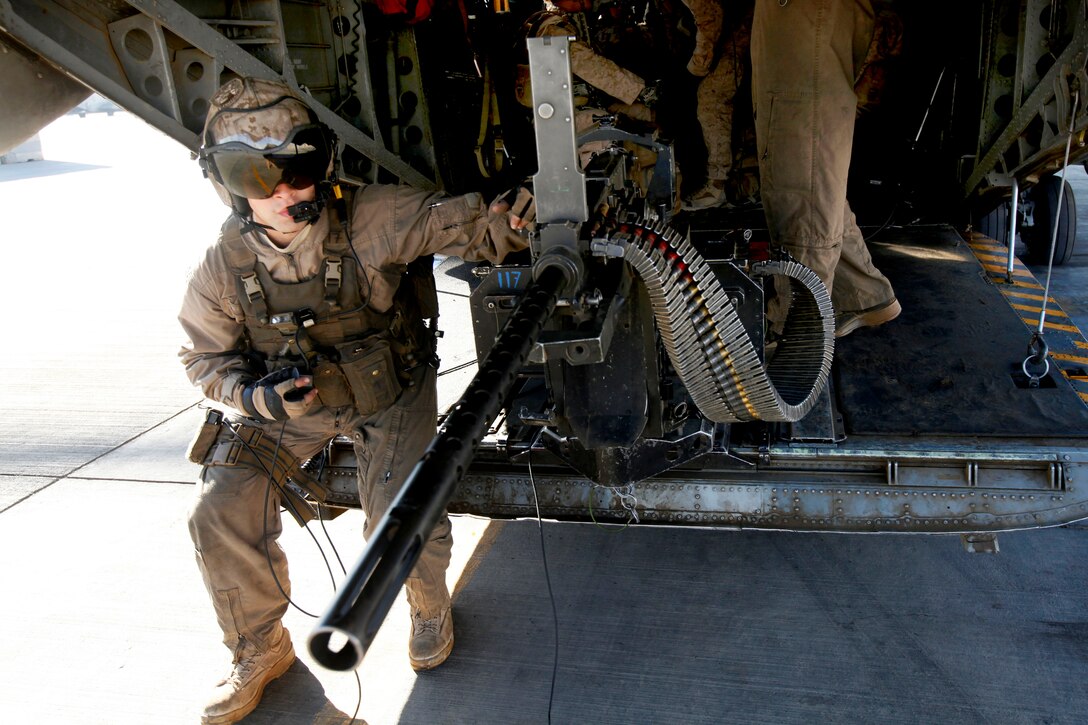 U.S. Marine Corps Cpl. Julio P. Ramos provides security using a .50 ...