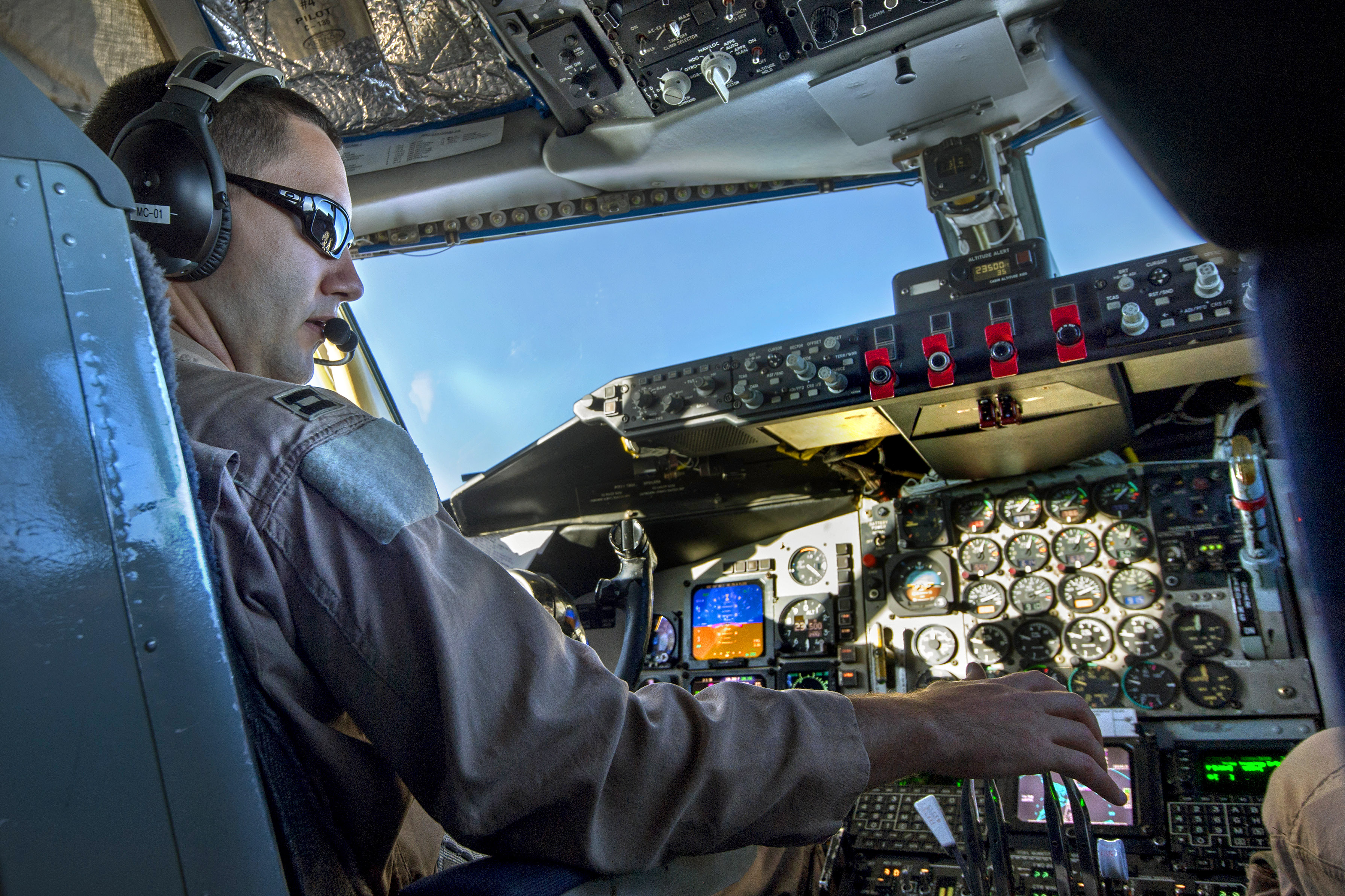 U.S. Air Force Capt. Derrick Baker maneuvers a KC-135R Stratotanker ...