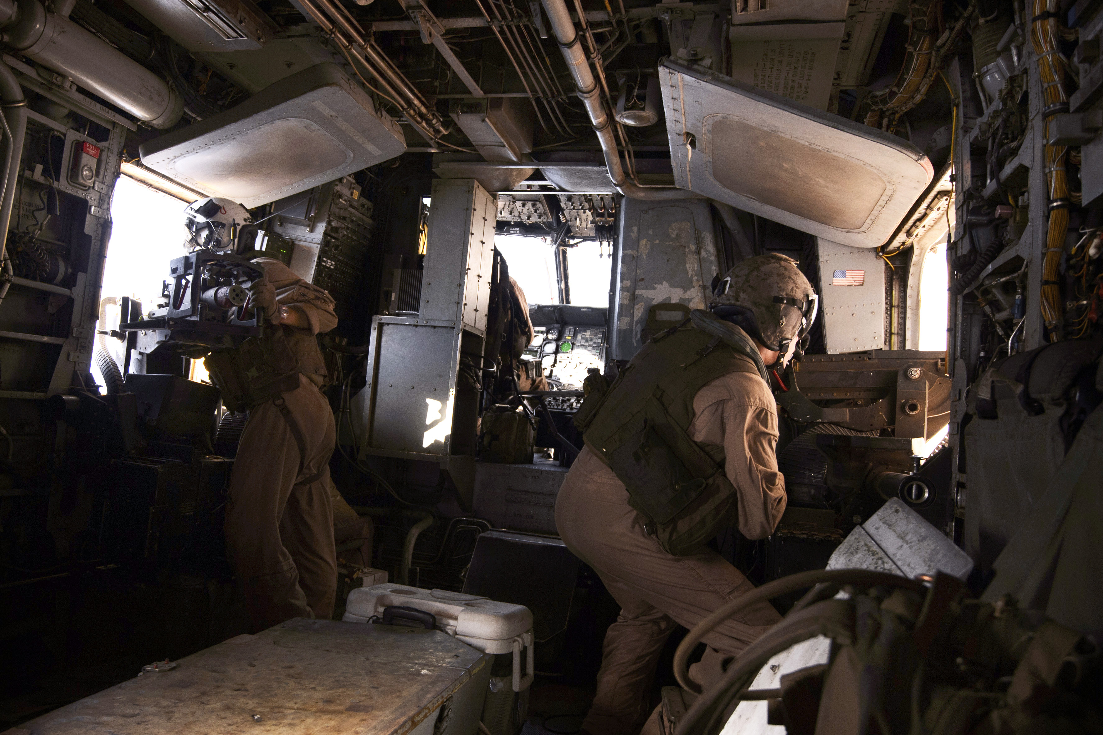 U.S. Marines provide security as a CH-53E Super Stallion helicopter ...