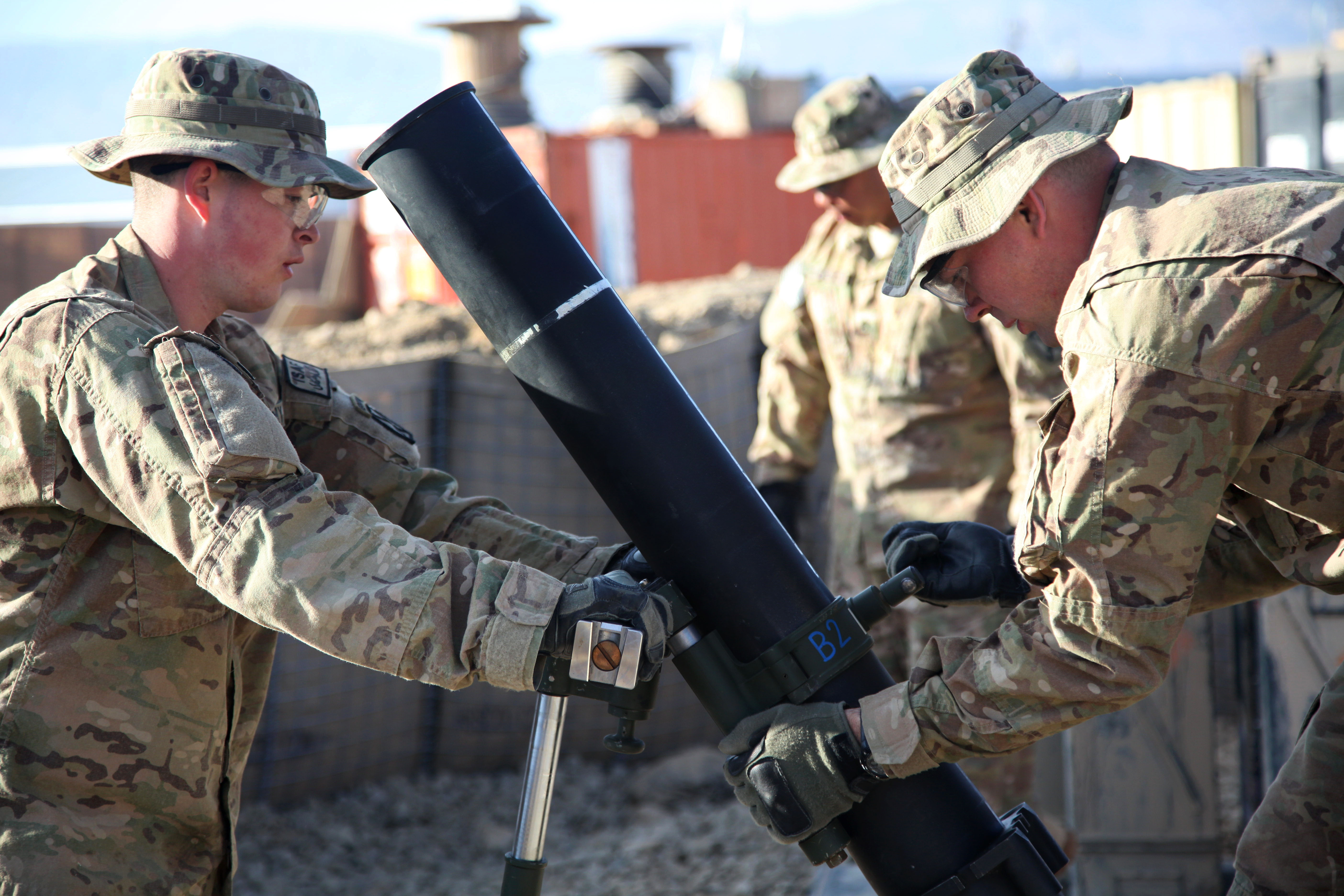 U.S. soldiers set up an M120 mortar system to provide base defense on Forward Operation Base ...