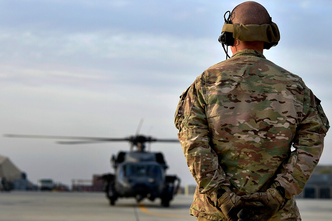 U.S. Air Force Airman 1st Class Josh Lombardo prepares to marshal a HH ...