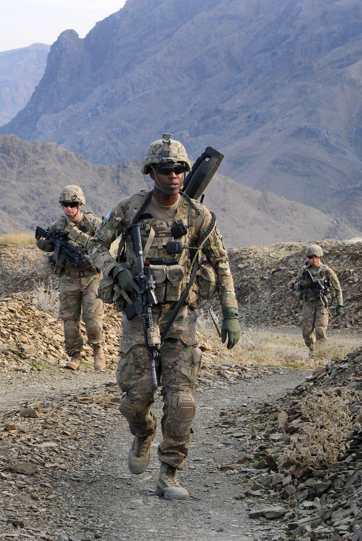 U.S. Army Sgt. Michael Weston, center, and his soldiers secure the rear ...