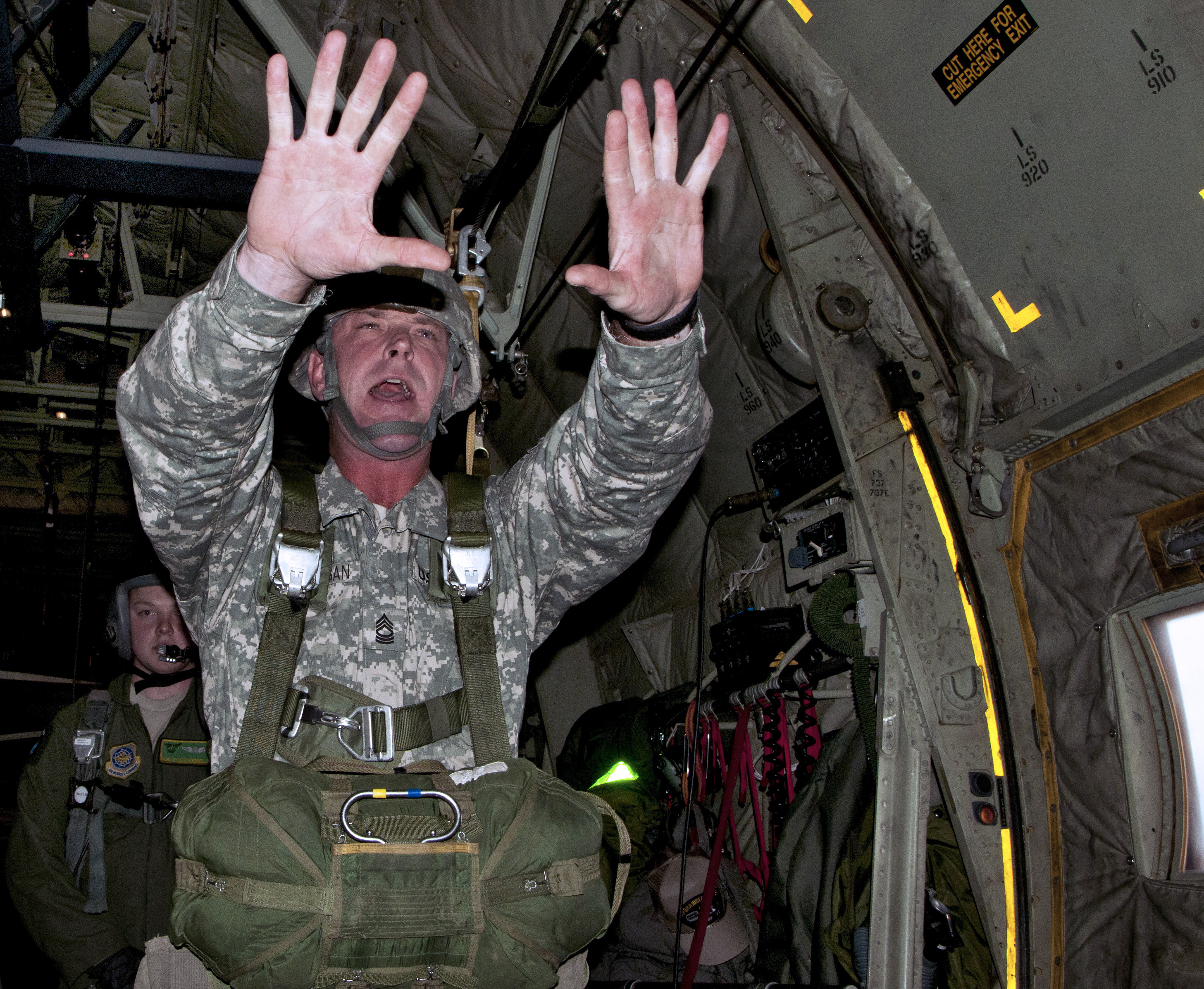 Army Master Sgt. Raymond Geoghegan gives the 10-minute time warning to paratroopers as they ...