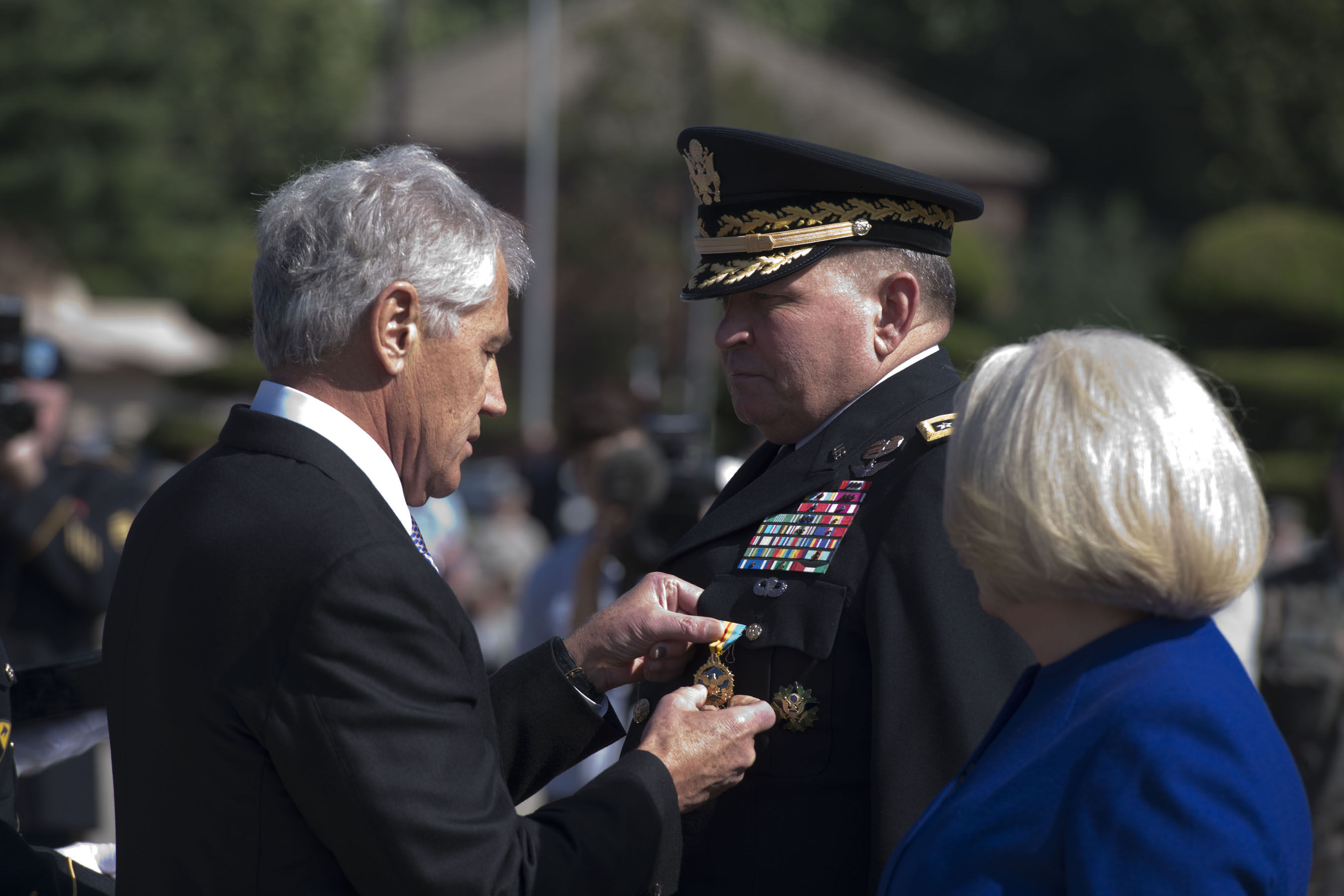 U.S. Defense Secretary Chuck Hagel presents U.S. Army Gen. James D. Thurman, outgoing commanding ...
