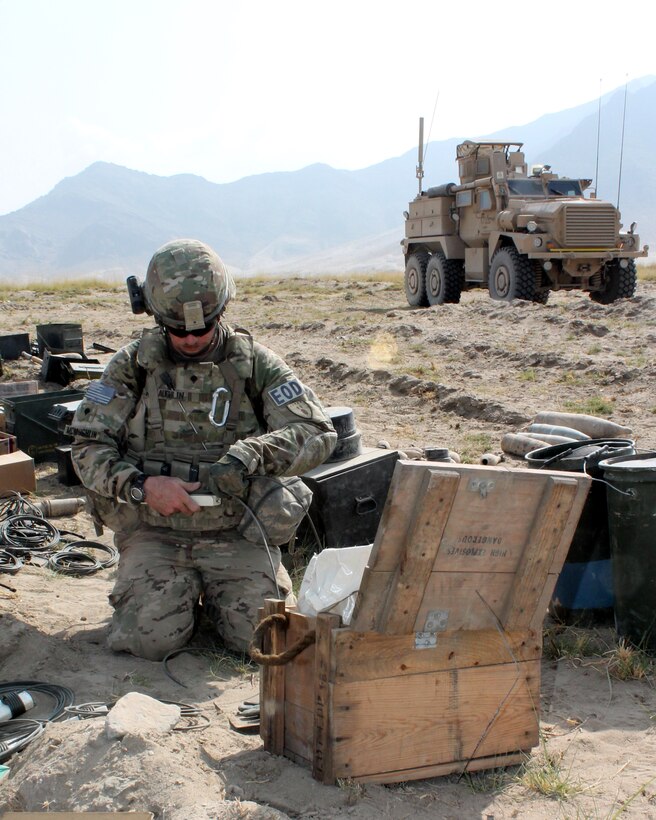 U.S. Army Spc. Christopher McLaughlin prepares C4 demolition charges ...