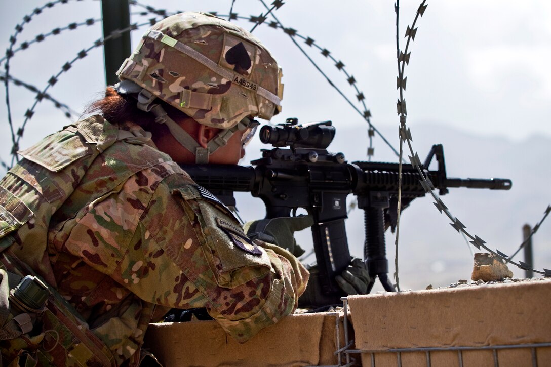 U.S. Army Pfc. Aleshia K. Anderson pulls security during a battle drill ...