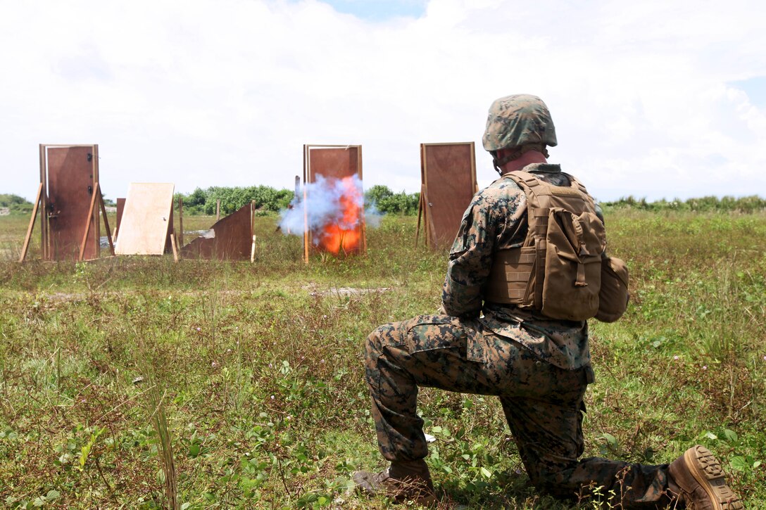 U.S. Marine Corps Lance Cpl. Wesley V. McCracken detonates a slider ...