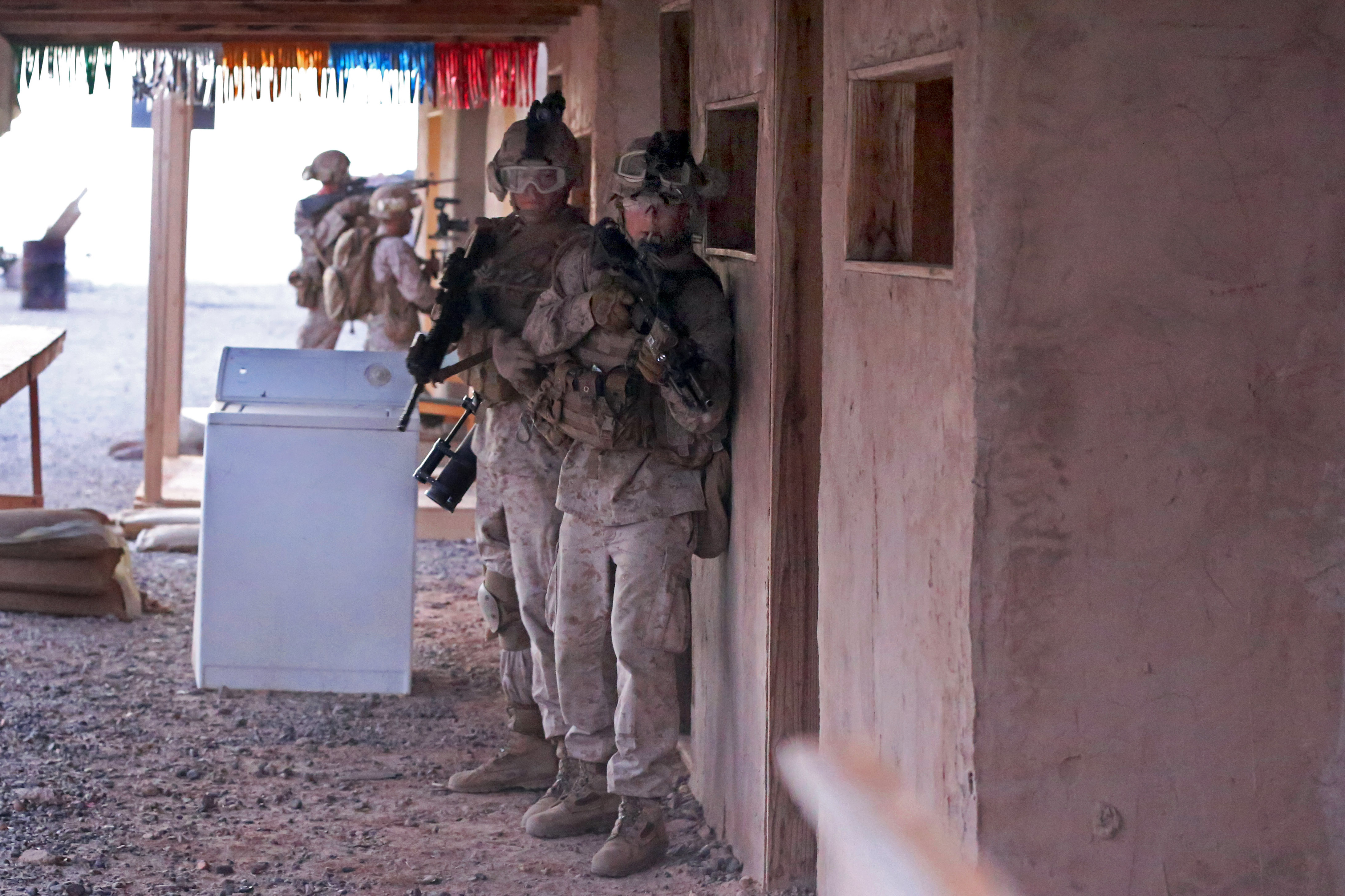 Marines prepare to enter a room containing enemy role players during a ...