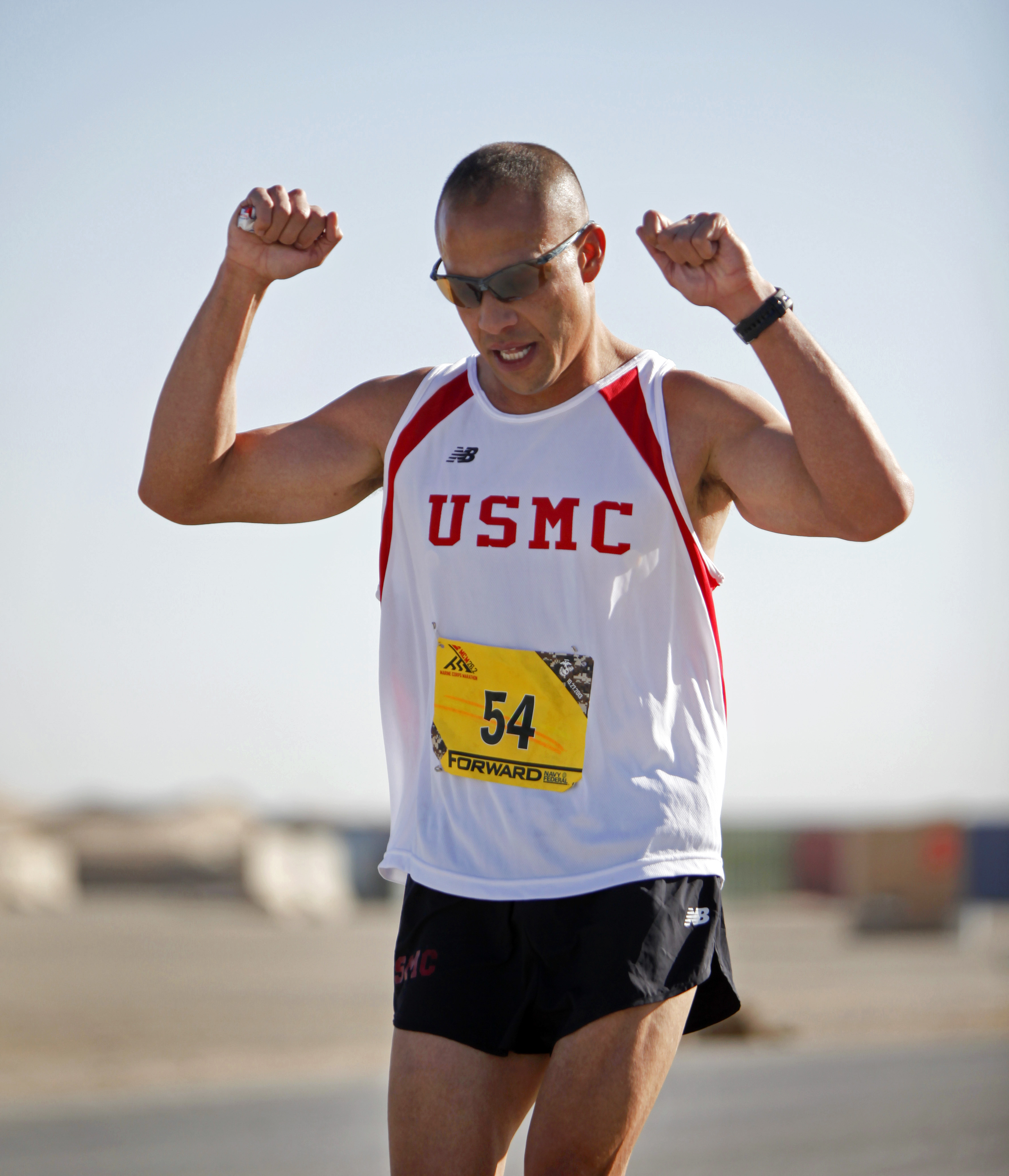 U.S. Marine Corps Capt. Pedro Rodriguez runs the 26.2-mile course of ...