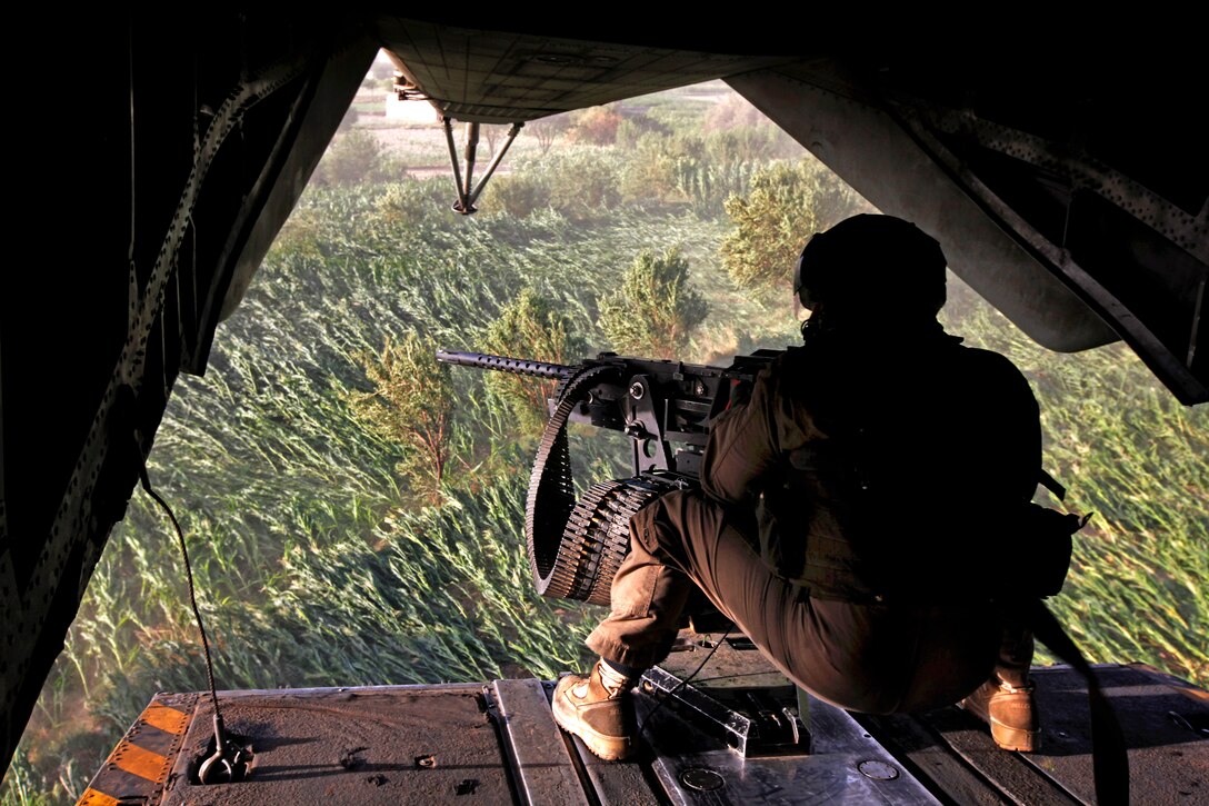 U.S. Marine Corps Gunnery Sgt. Marcus S. McCollum provides aerial ...