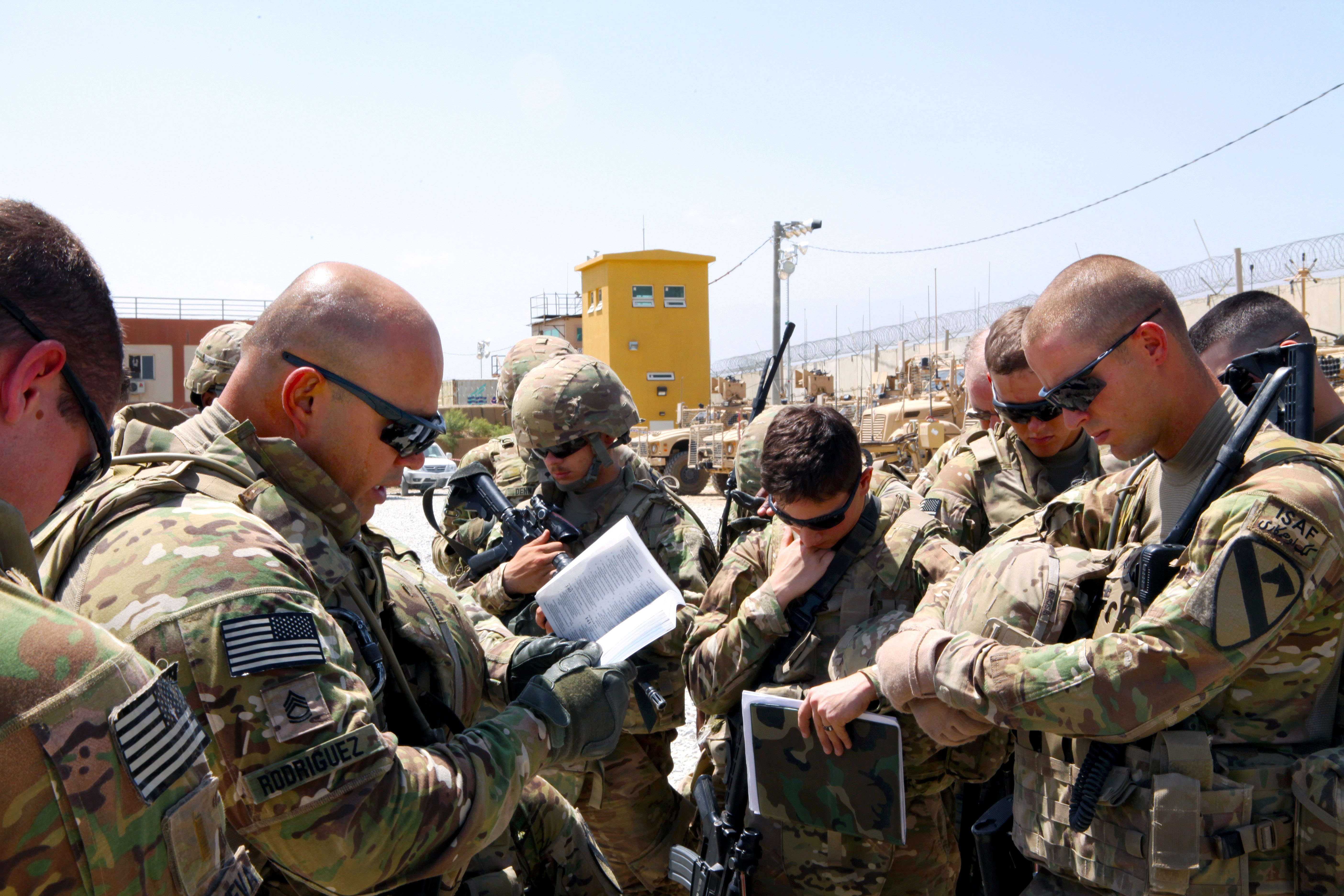 U.S. Army Sgt. 1st Class Jose Rodriguez, left center, conducts a pre ...