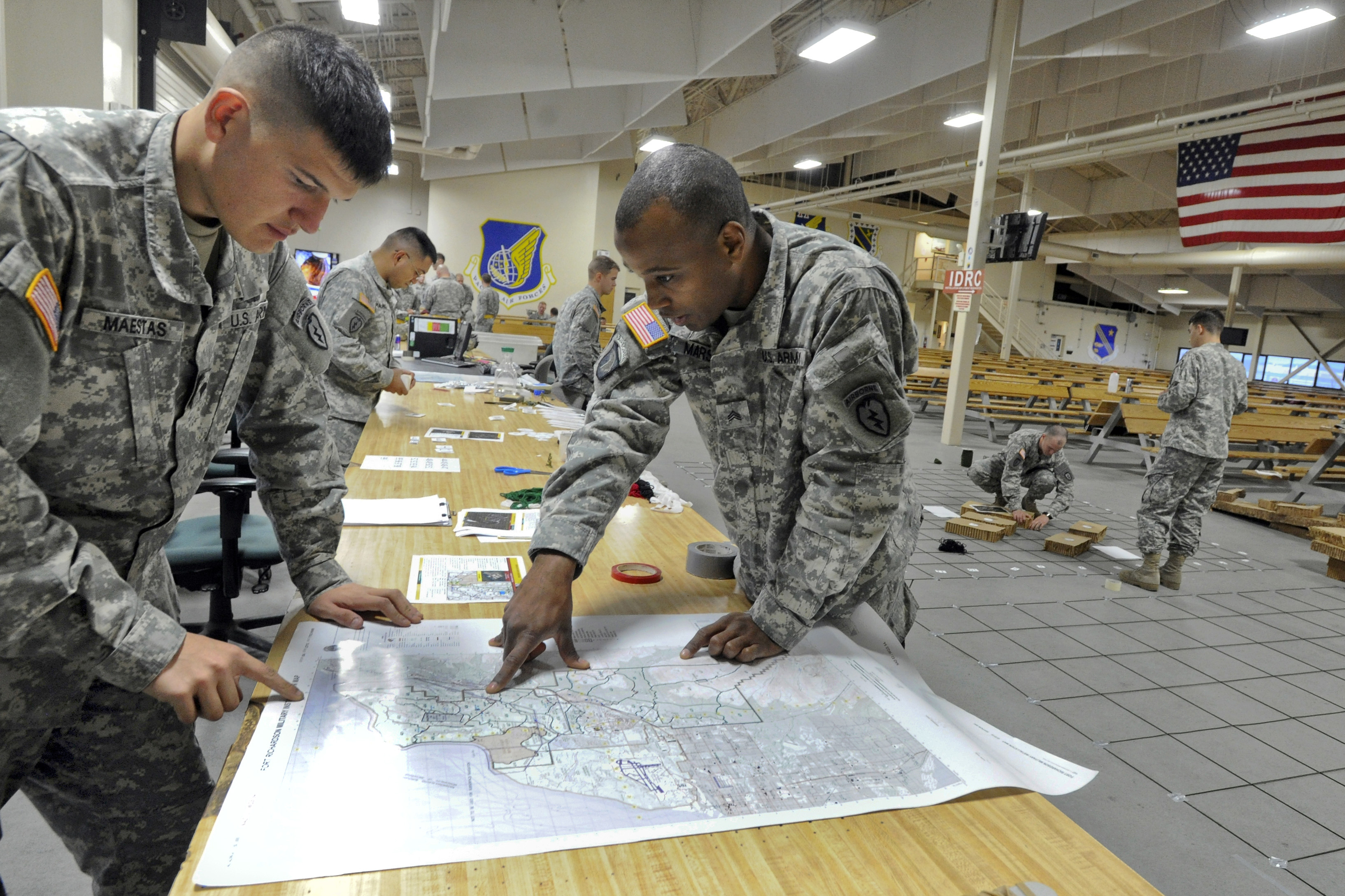 Army Spc. Michael Maestas, left, and Army Sgt. Cameron Marsh look over ...