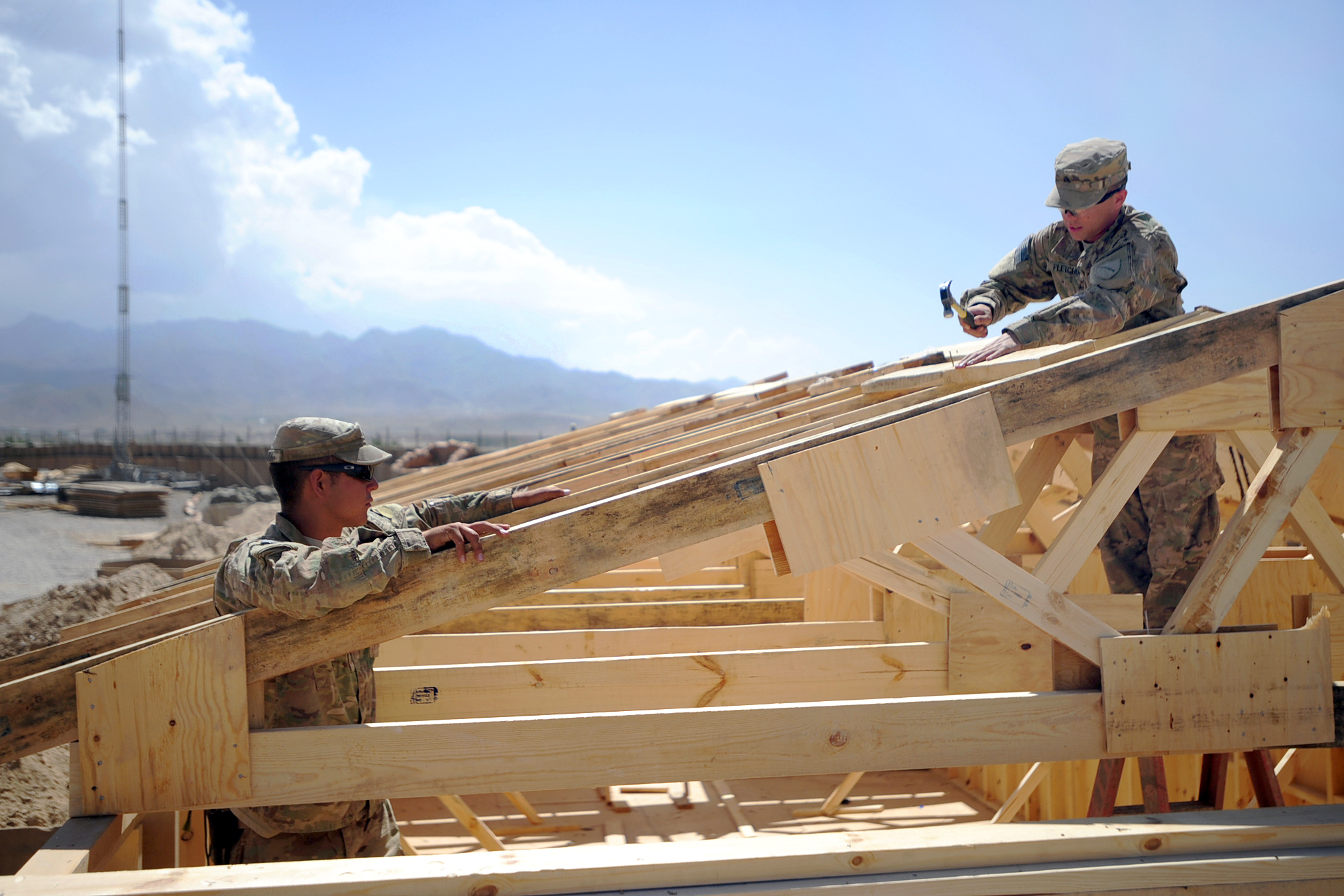U.S. Army Spc. Jared Jordan, left, provides support as U.S. Army Sgt ...