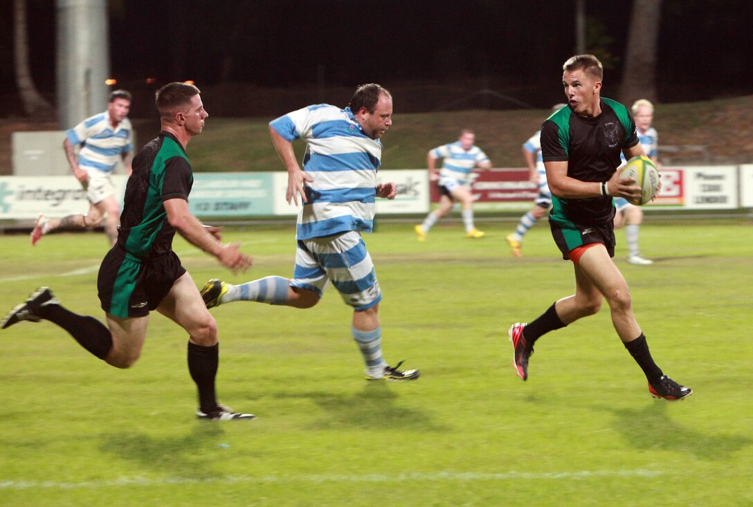 A Darwin rugby team player prepares to throw the ball during the first ...