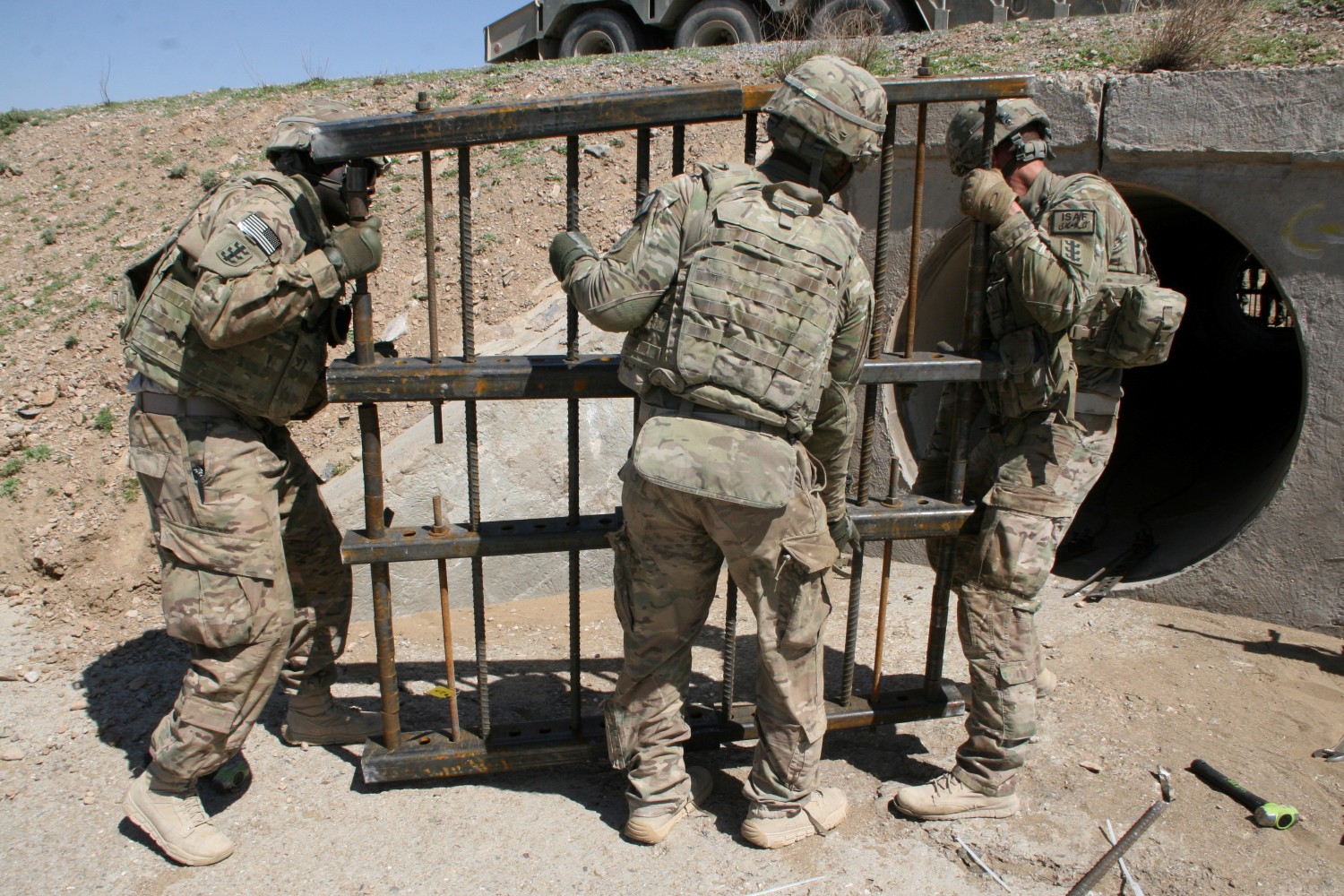 Coalition forces install culvert denial systems to prevent IED placement