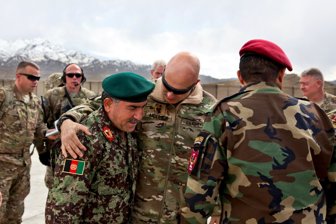 U.S. Army Lt. Gen. Joseph Anderson, center, commander of the ...
