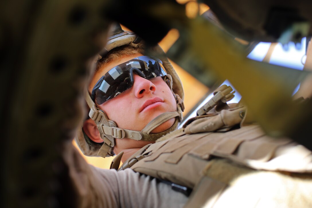 U.S. Marine Corps Lance Cpl. Chase Gindin provides security while ...