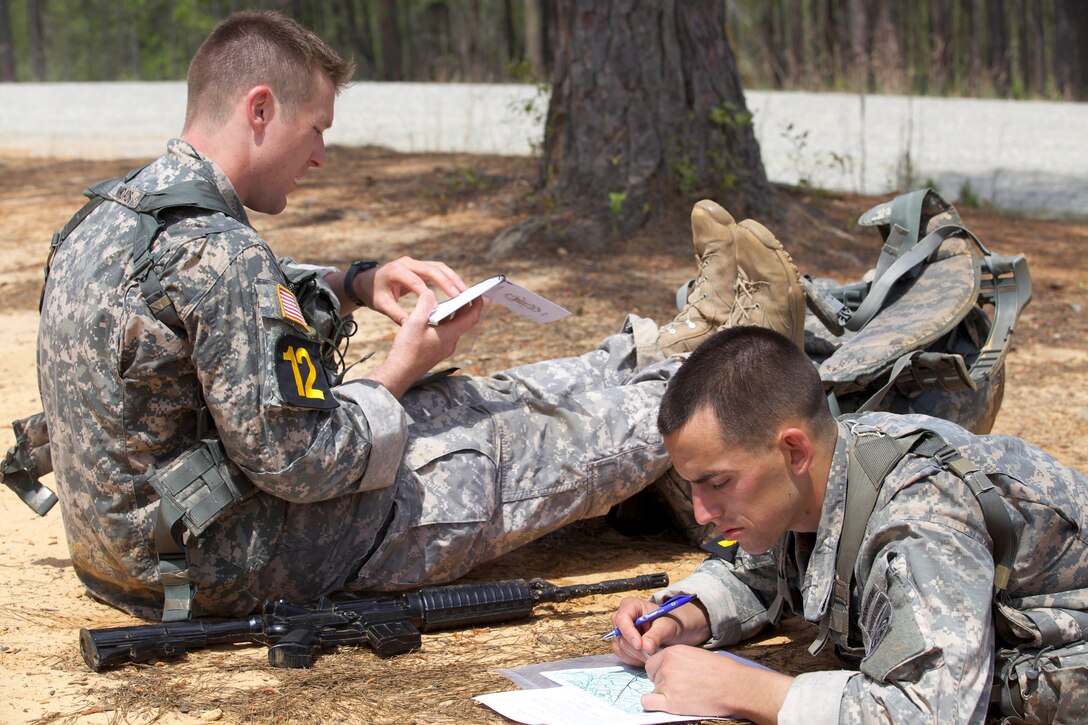 Army Capt. Alexander Rhoads, left, and Army 1st Lt. James Teskey map ...