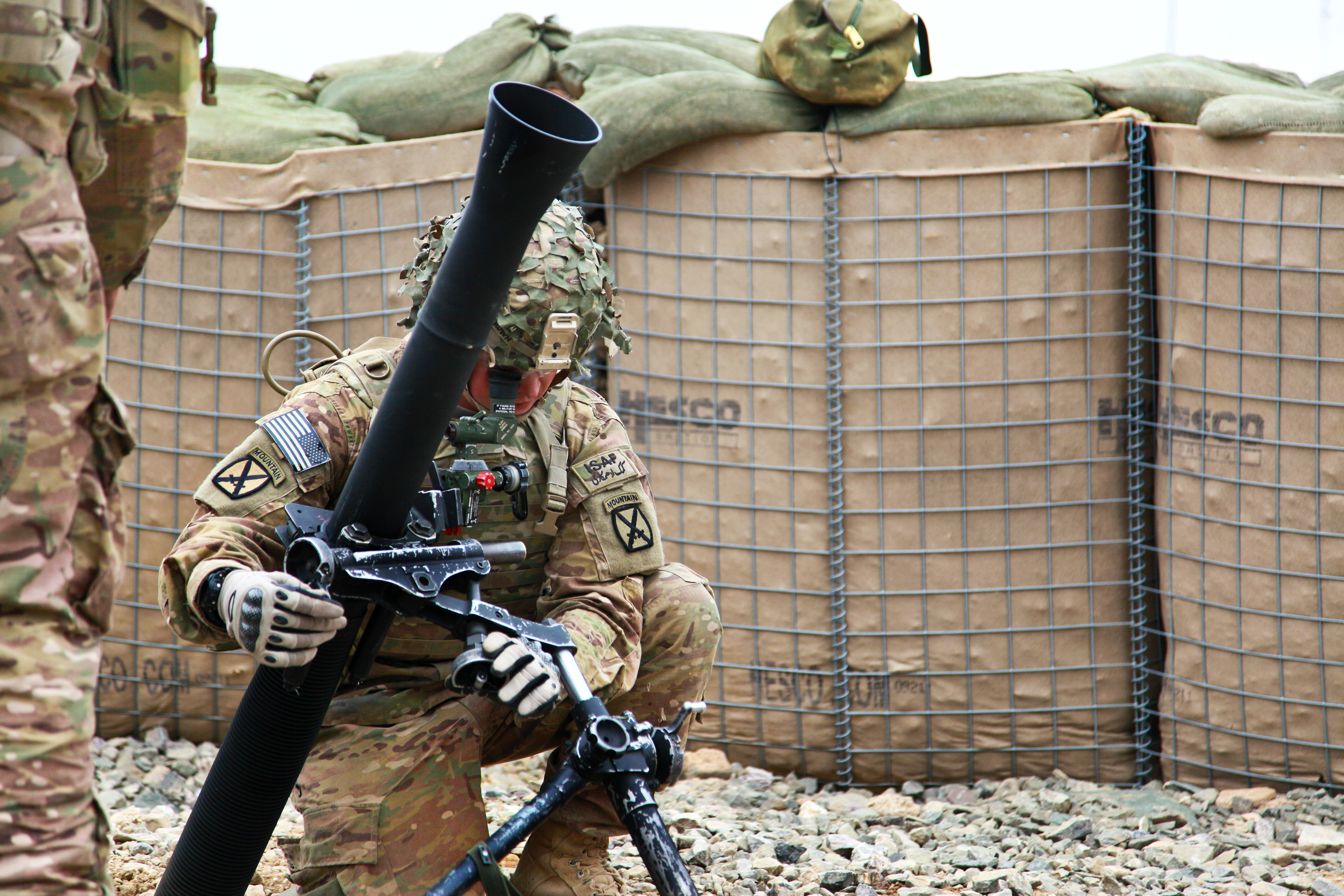 U.S. Army Pfc. Joshua Brown checks the settings on a target site during ...