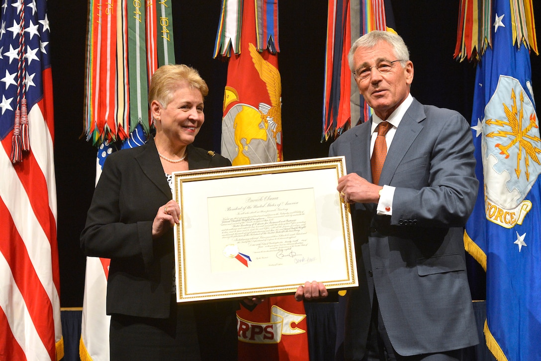 Defense Secretary Chuck Hagel presents Jessica L. Wright ...