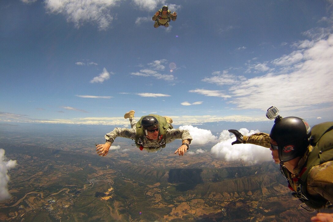 U.S. paratroopers track with fellow parachutists during an ...