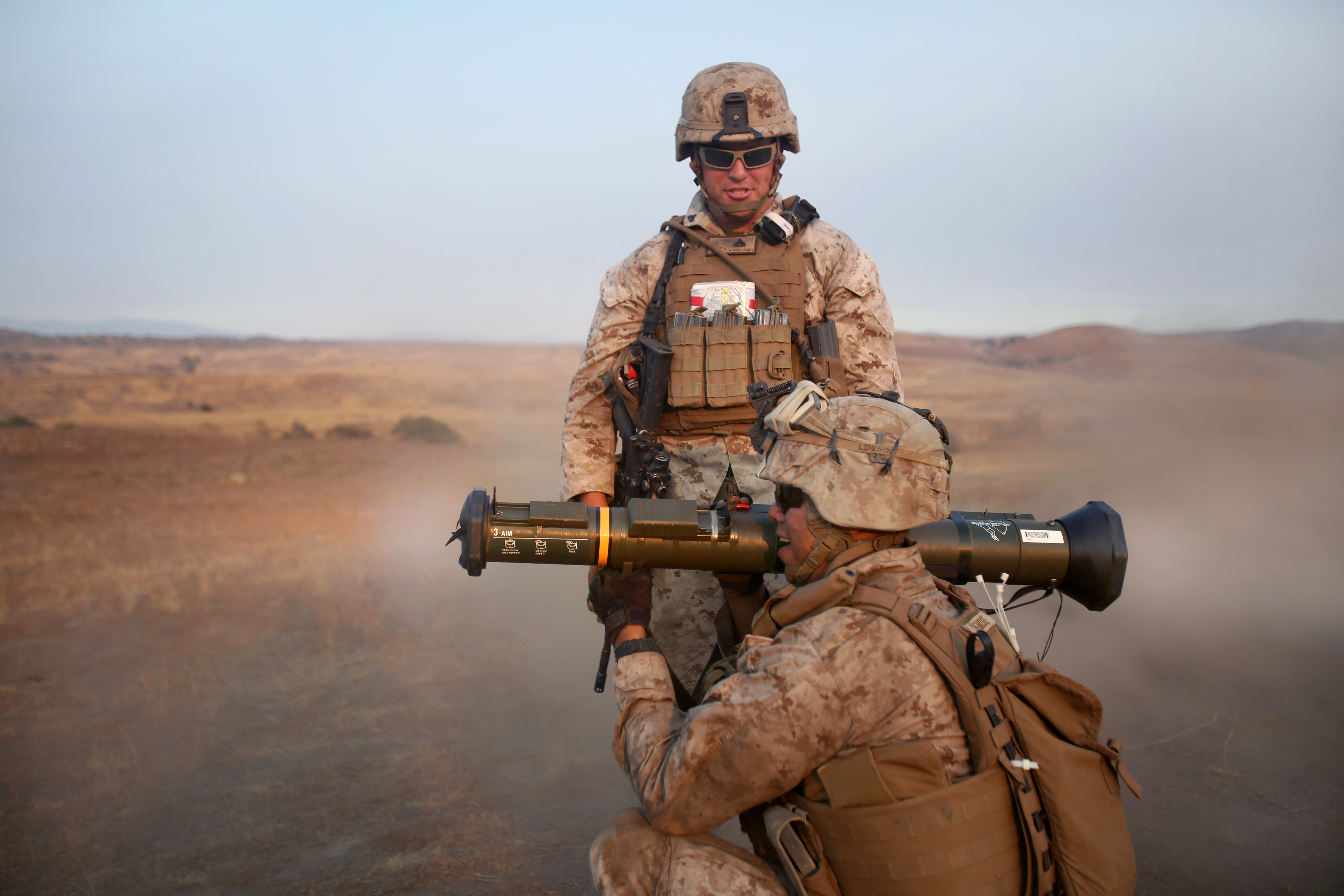 Marine Corps Lance Cpl. Jacob Dehose, foreground, reacts after firing ...