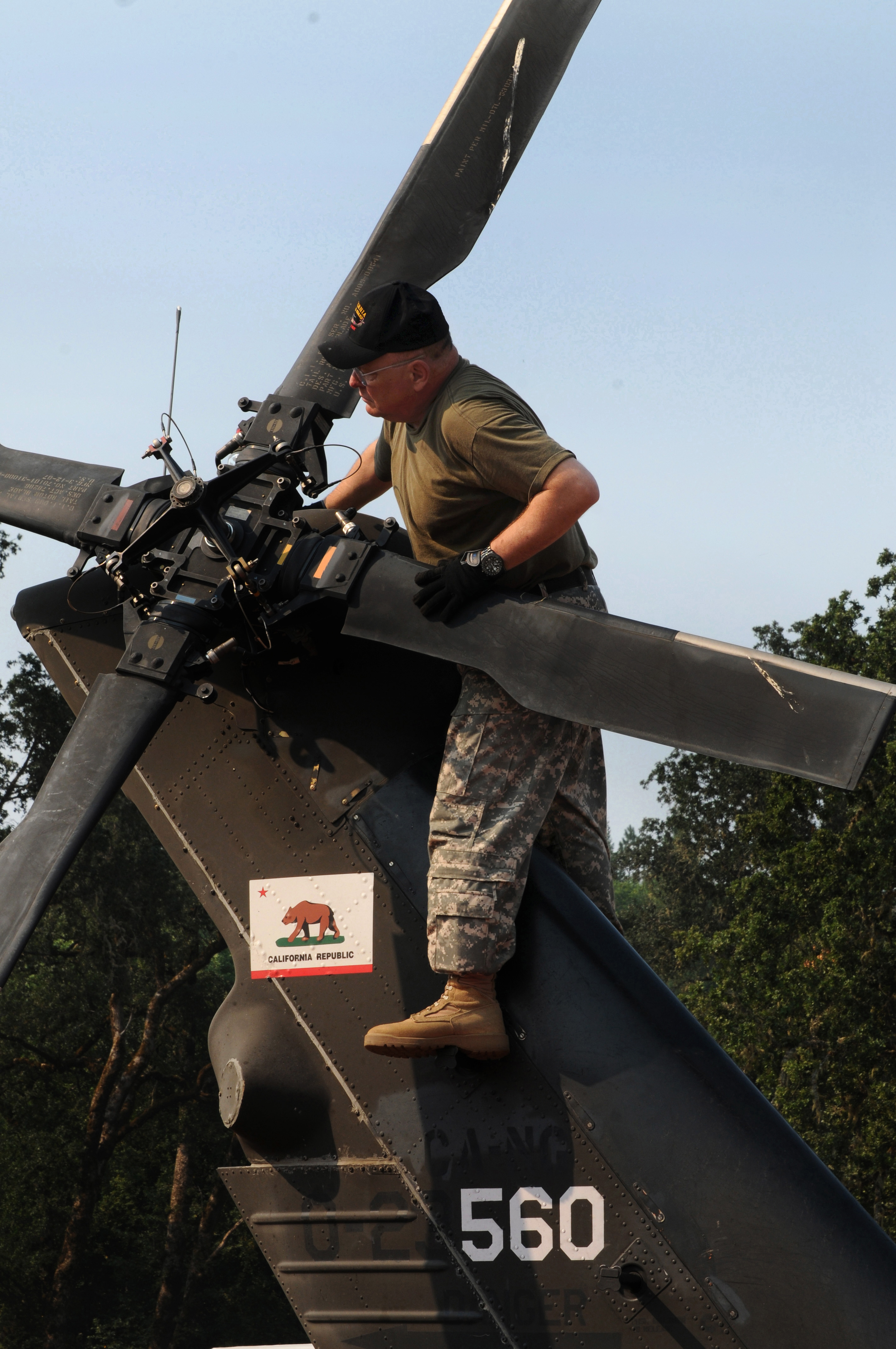 Army Chief Warrant Officer Chris Good conducts a preflight inspection ...