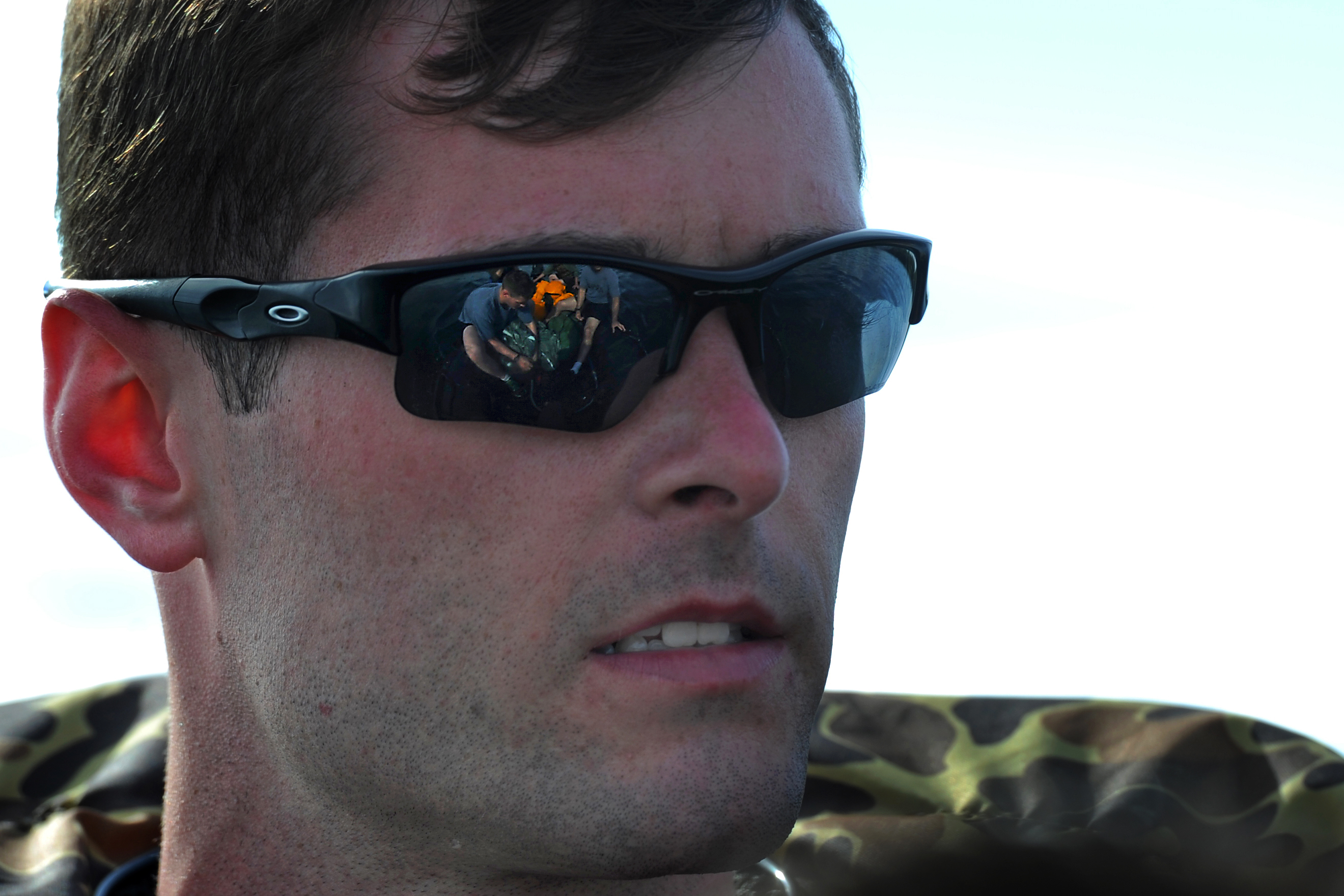 The sunglasses of Army Sgt. Weston Warren reflects Army 2nd Lt ...