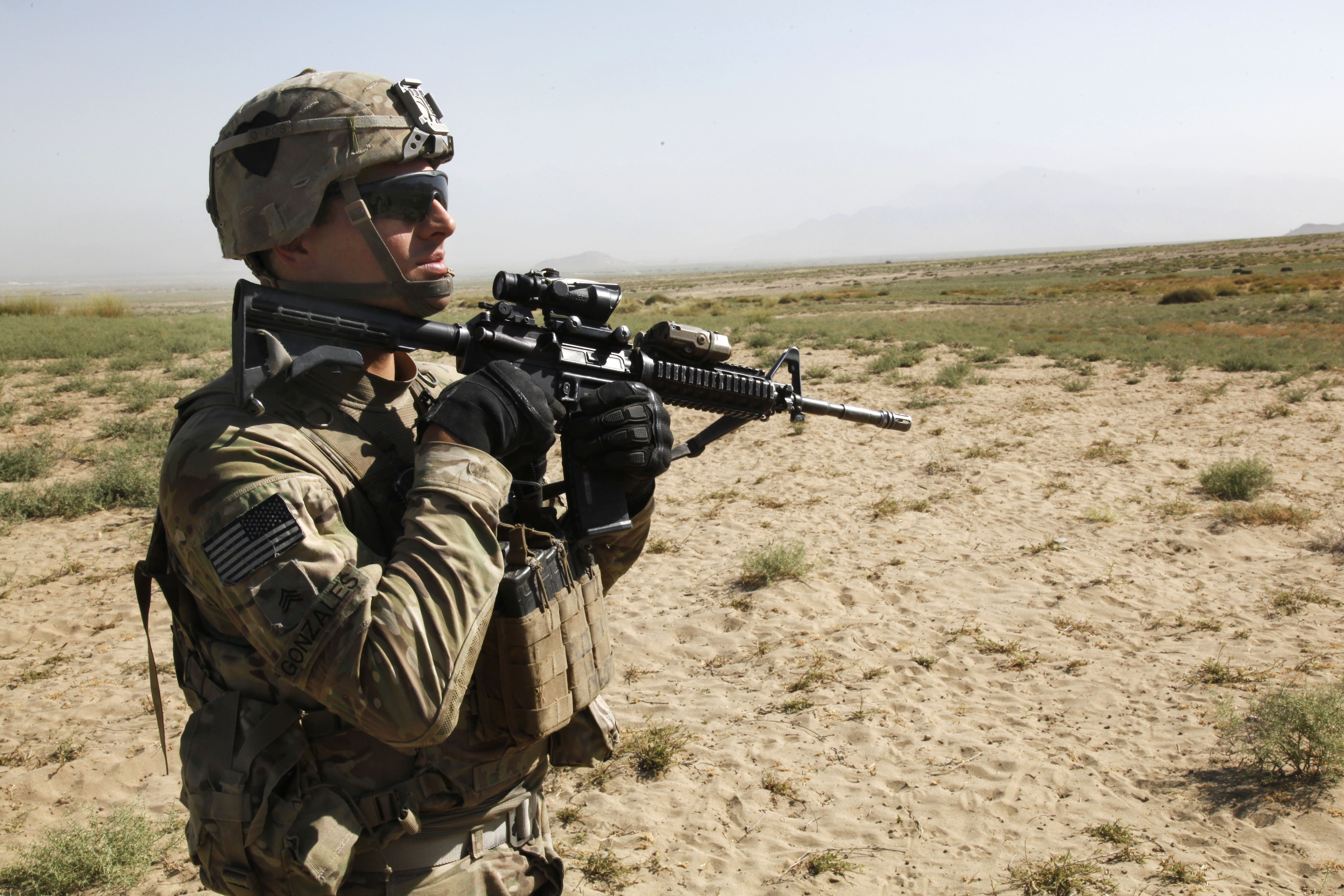 U.S. Army Sgt. Mario Gonzales provides security during a patrol in ...