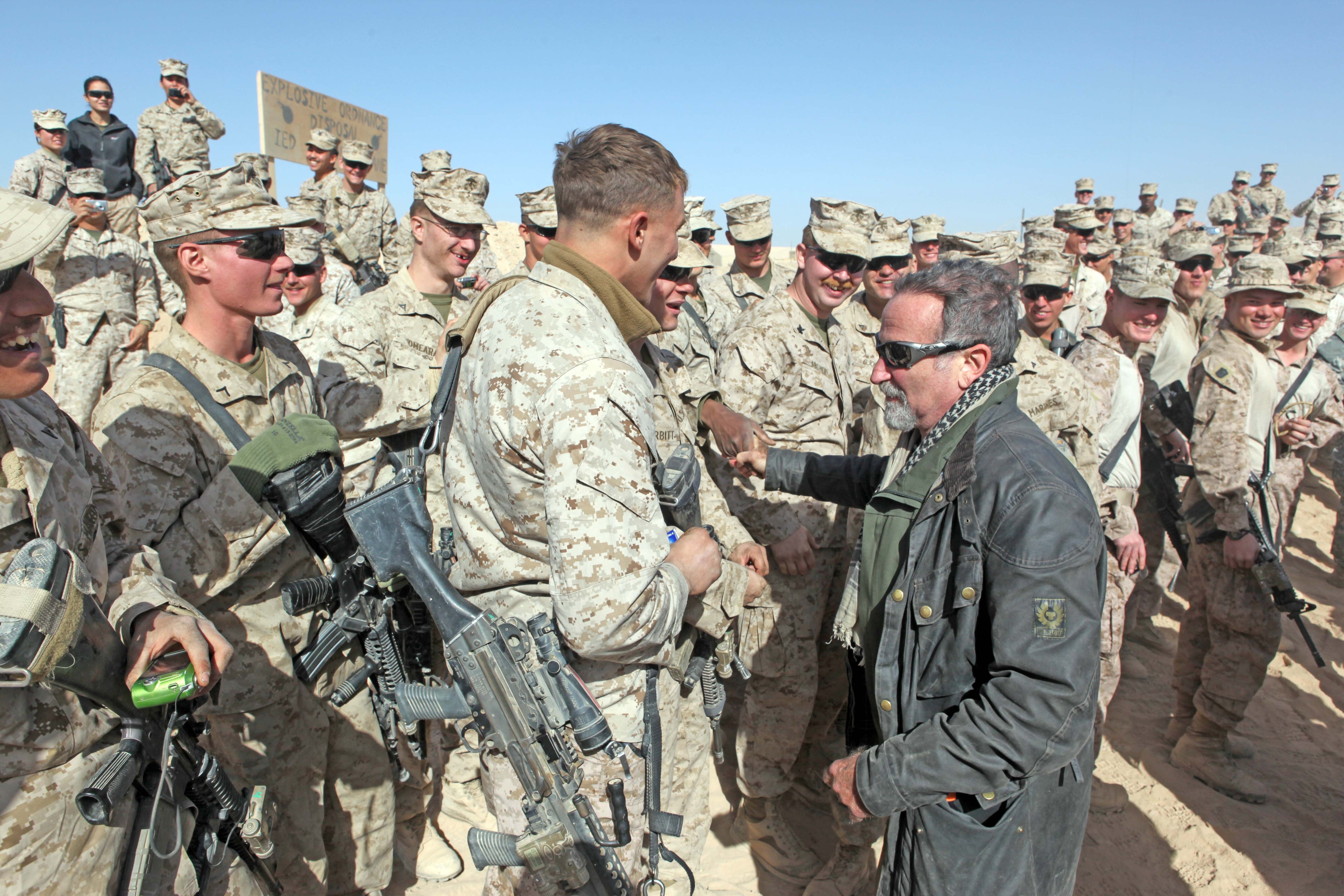 Actor-comedian Robin Williams shakes hands with U.S. Marines during a ...
