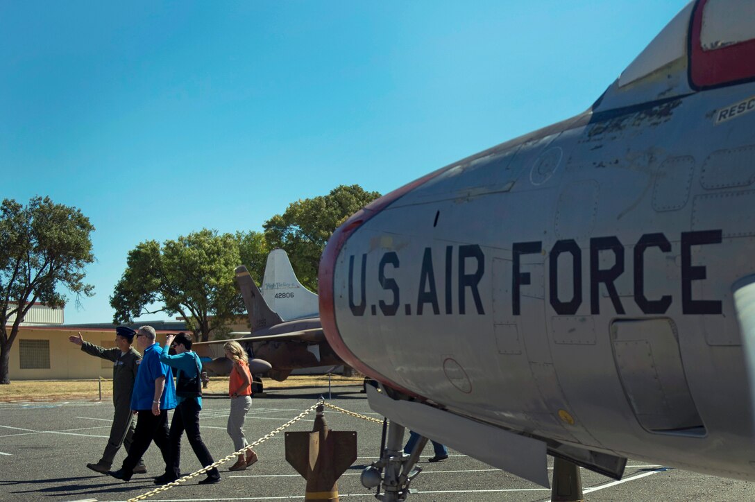Deputy Defense Secretary Bob Work walks with Air Force Col. David R ...