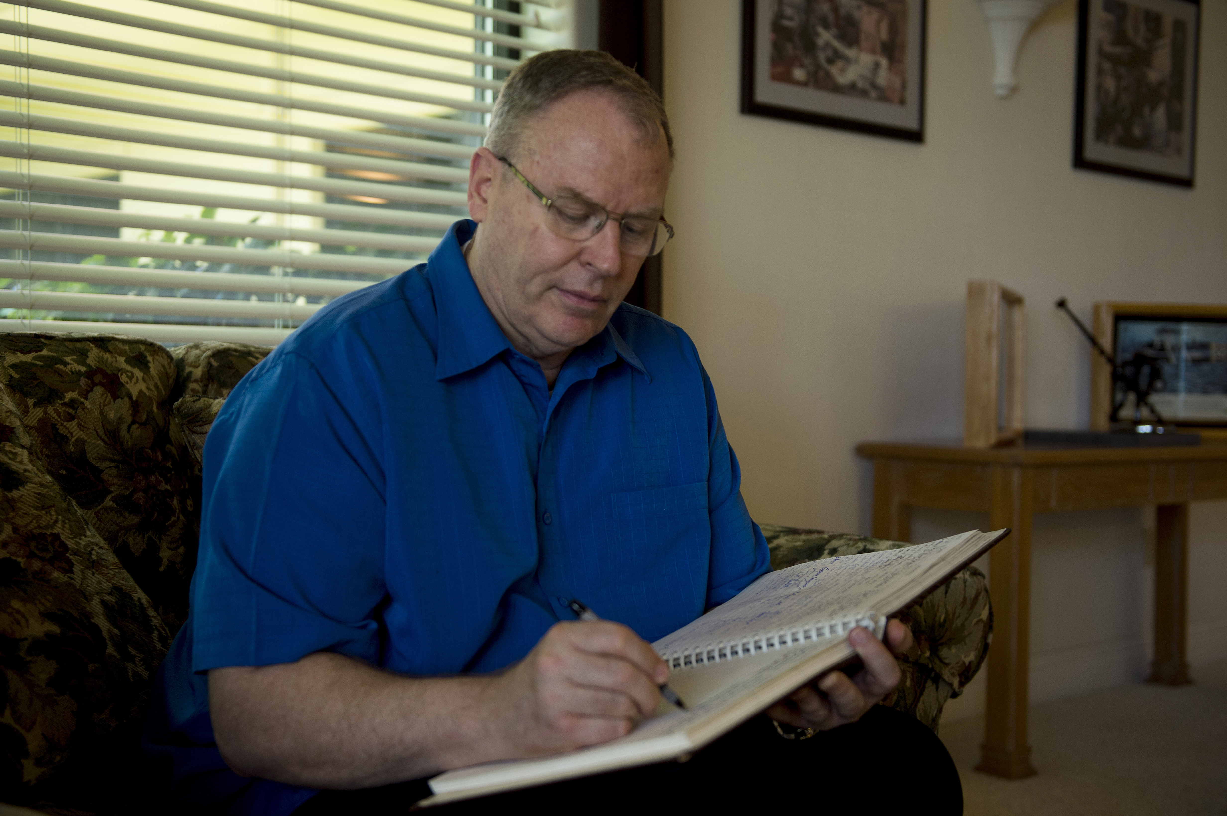 Deputy Defense Secretary Bob Work signs the distinguished visitor guest ...