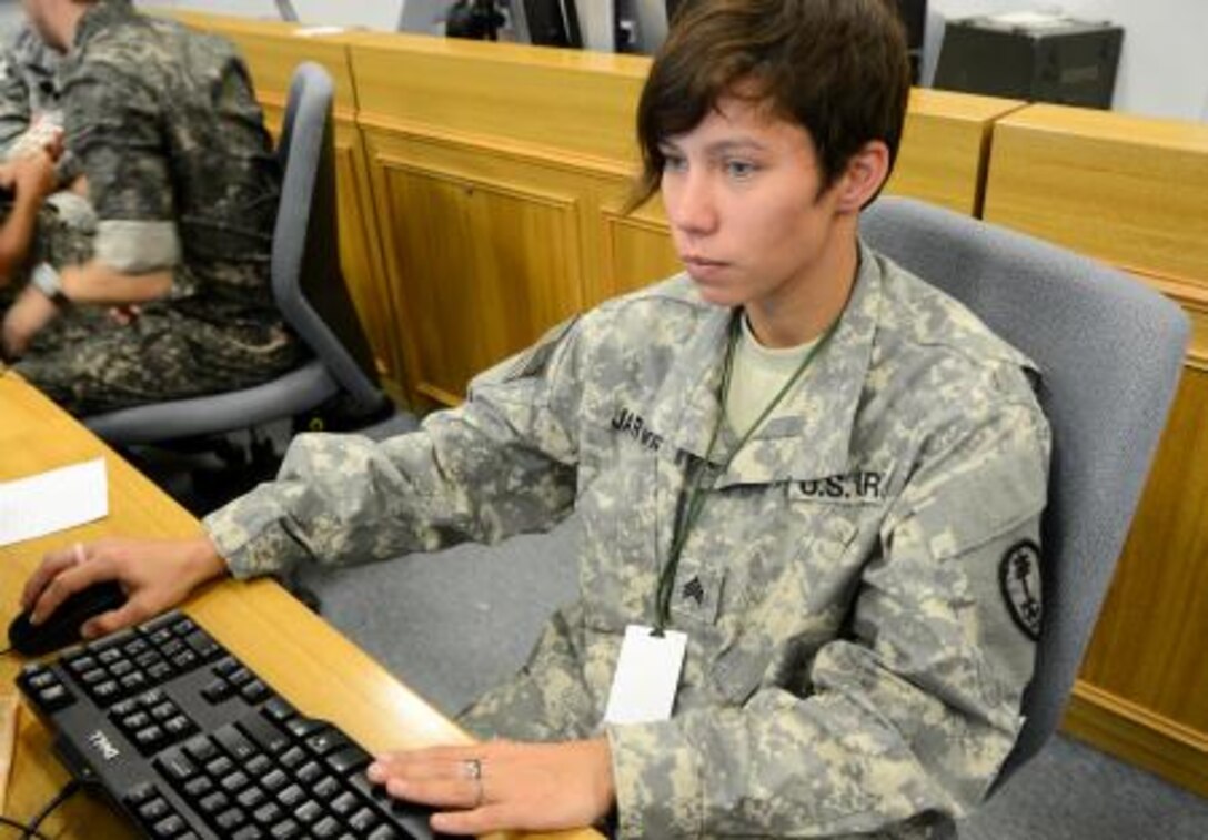 U.S. Army Sgt. Wendy Jarvis, with the 300th Military Police, works in ...