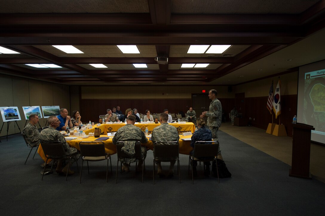 U.S. Deputy Defense Secretary Bob Work listens to a briefing by U.S ...