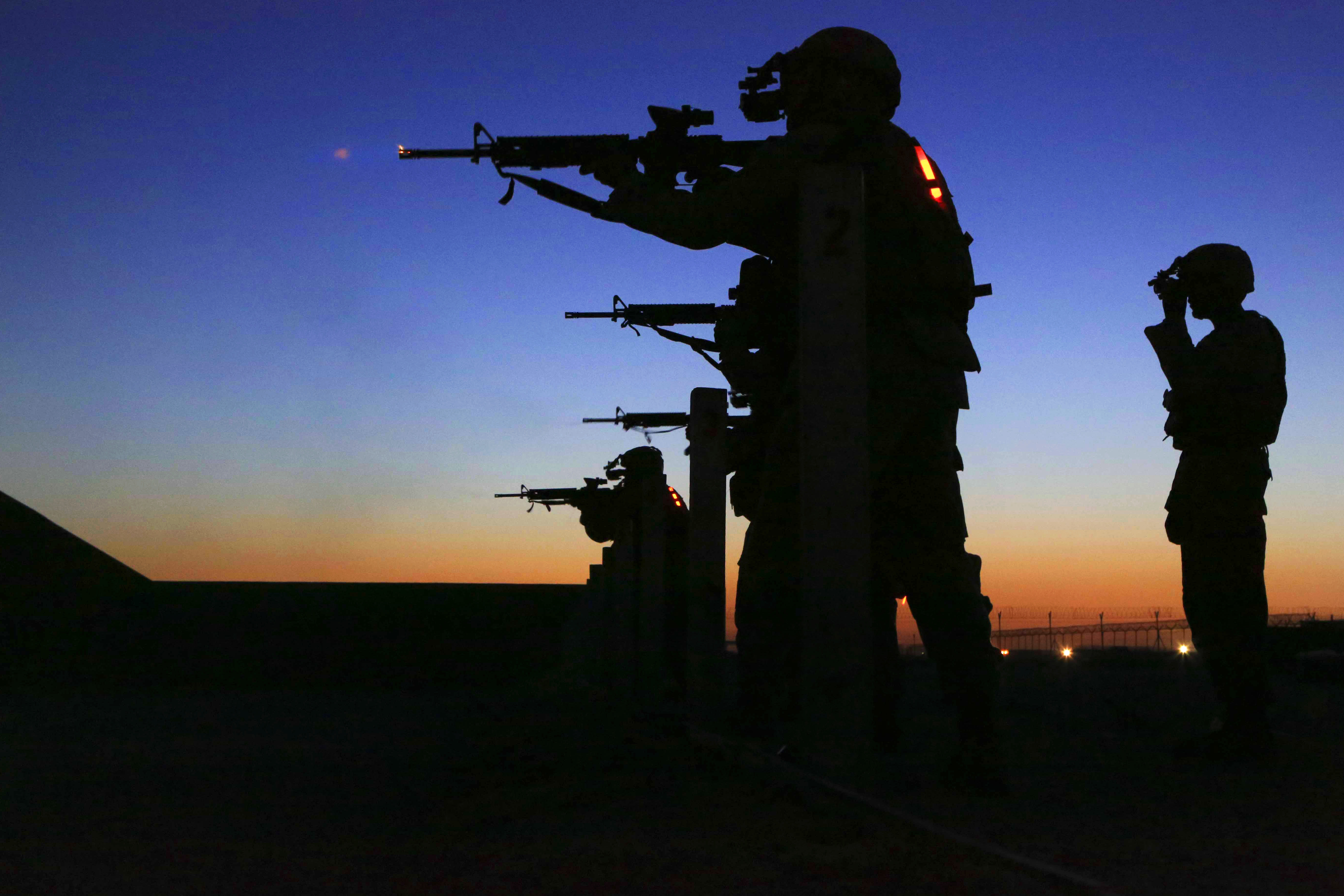 U.S. Marine Sgt. Lonnie Smith Jr., right, observes as U.S. Marines ...