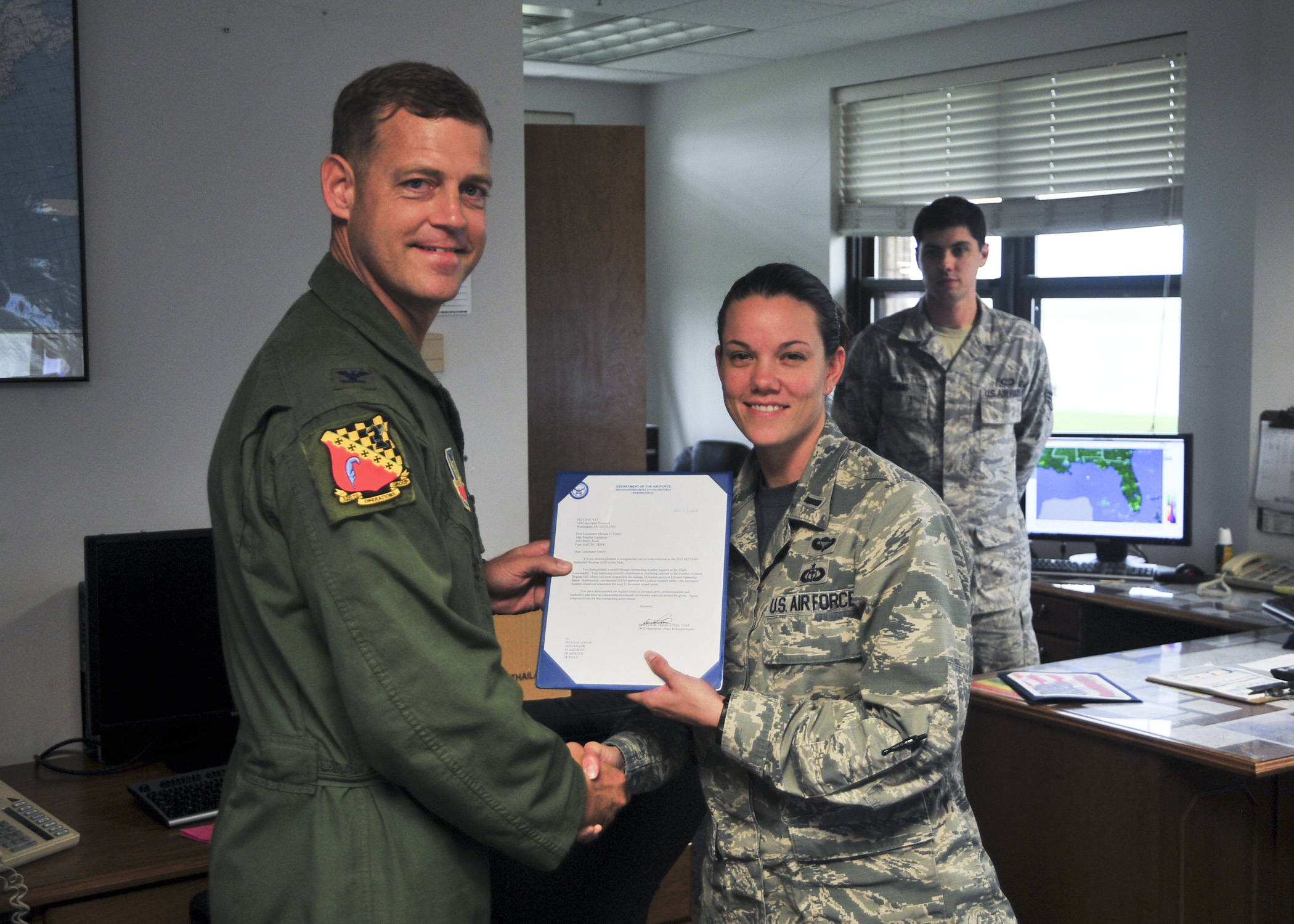 Colonel Max Marosko, 325th Operations Group commander, awards 1st Lt ...