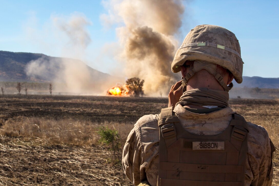U.S. Marines watch as explosives detonate during Exercise Koolendong 14 ...