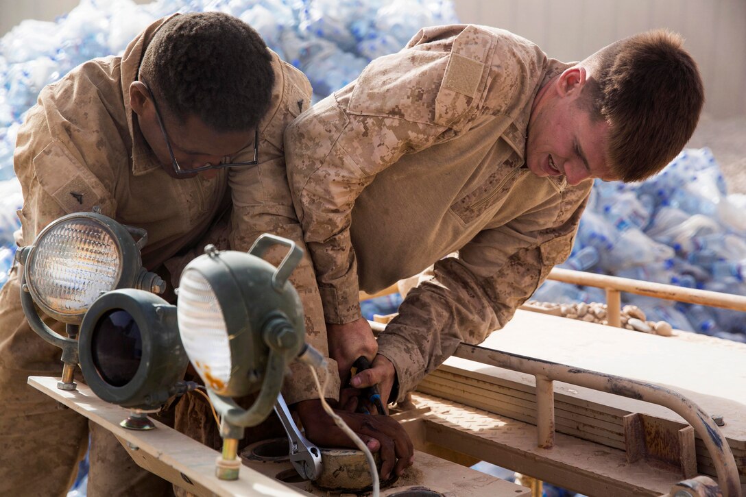 U.S. Marine Lance Cpls. Jose D. Munoz, left, and Dylan Eckley ...