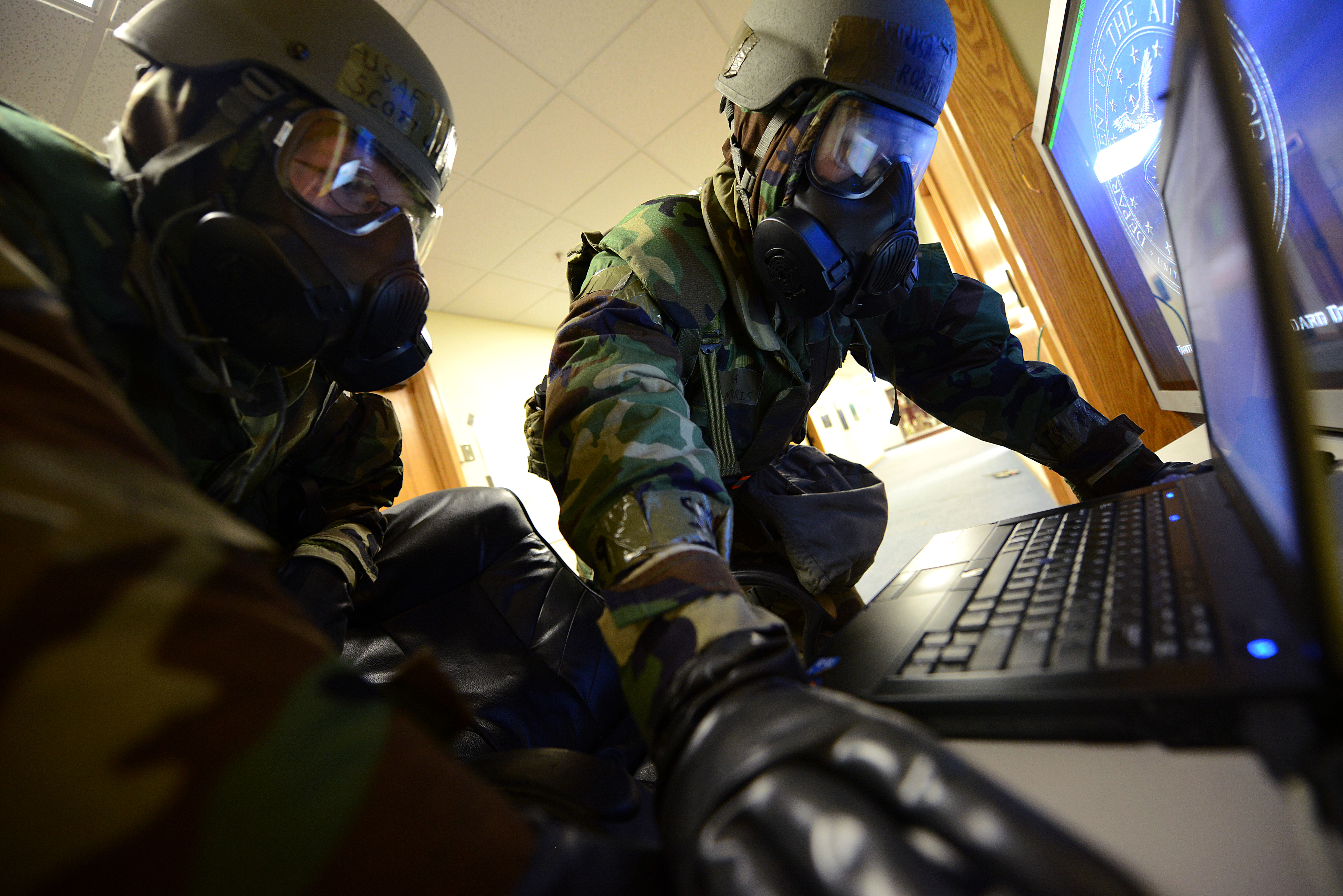 Airmen don gas masks, training gear for MFE