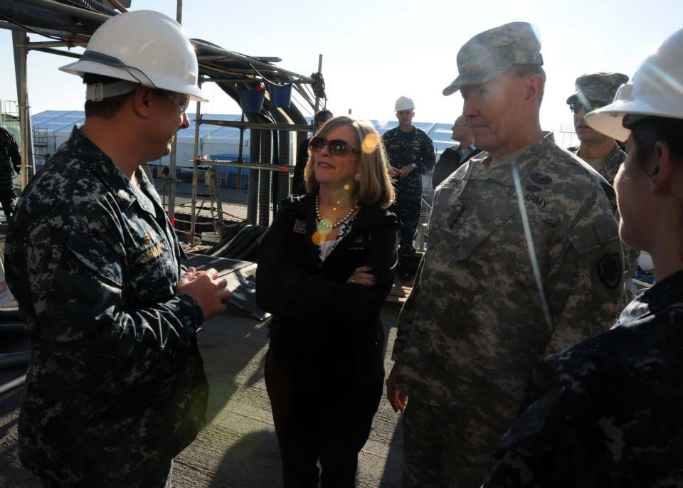 U.S. Navy Cmdr. Tadd Gorman, left, commanding officer of the USS Ross ...