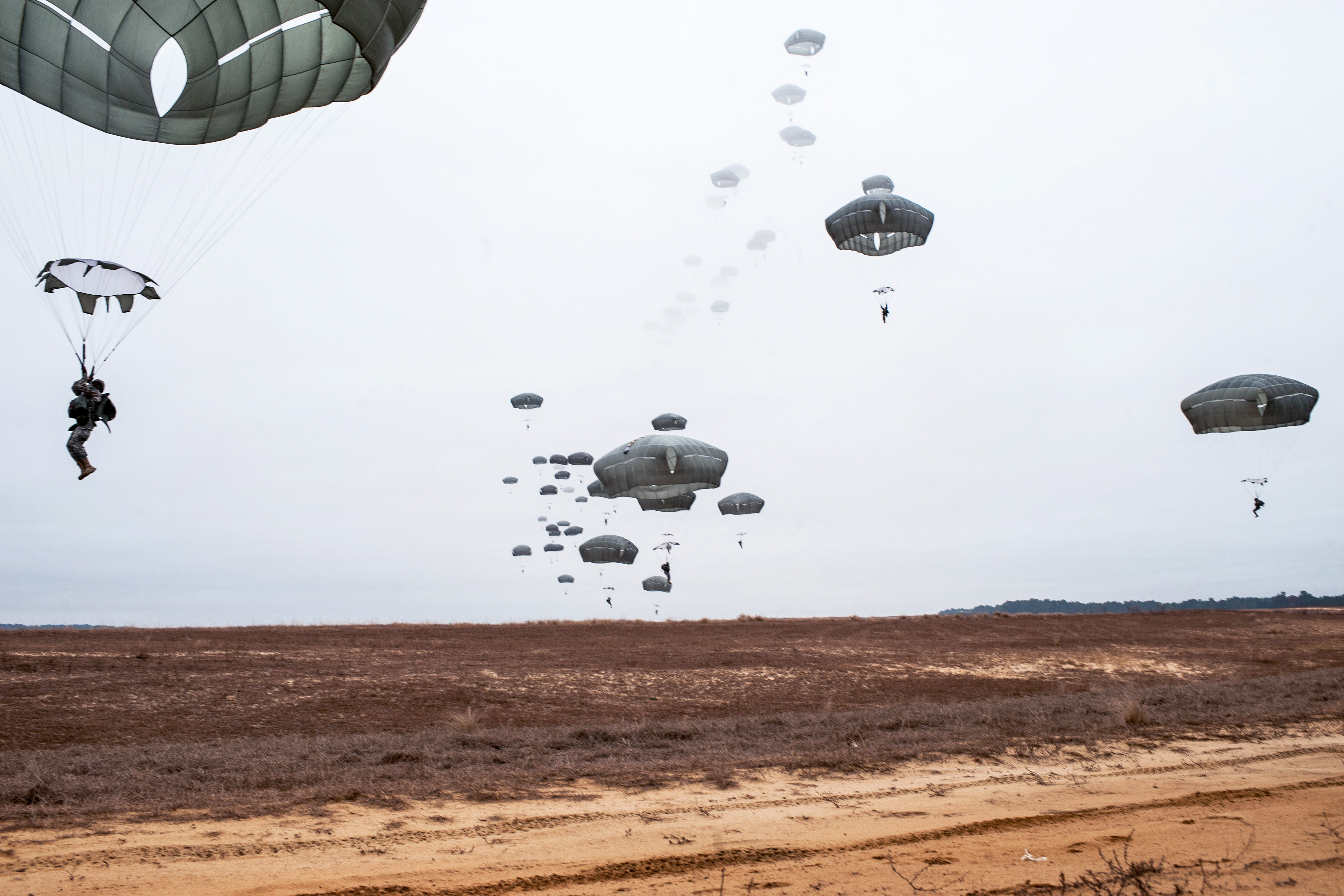 Army paratroopers fill the sky over Sicily drop zone for the 17th ...