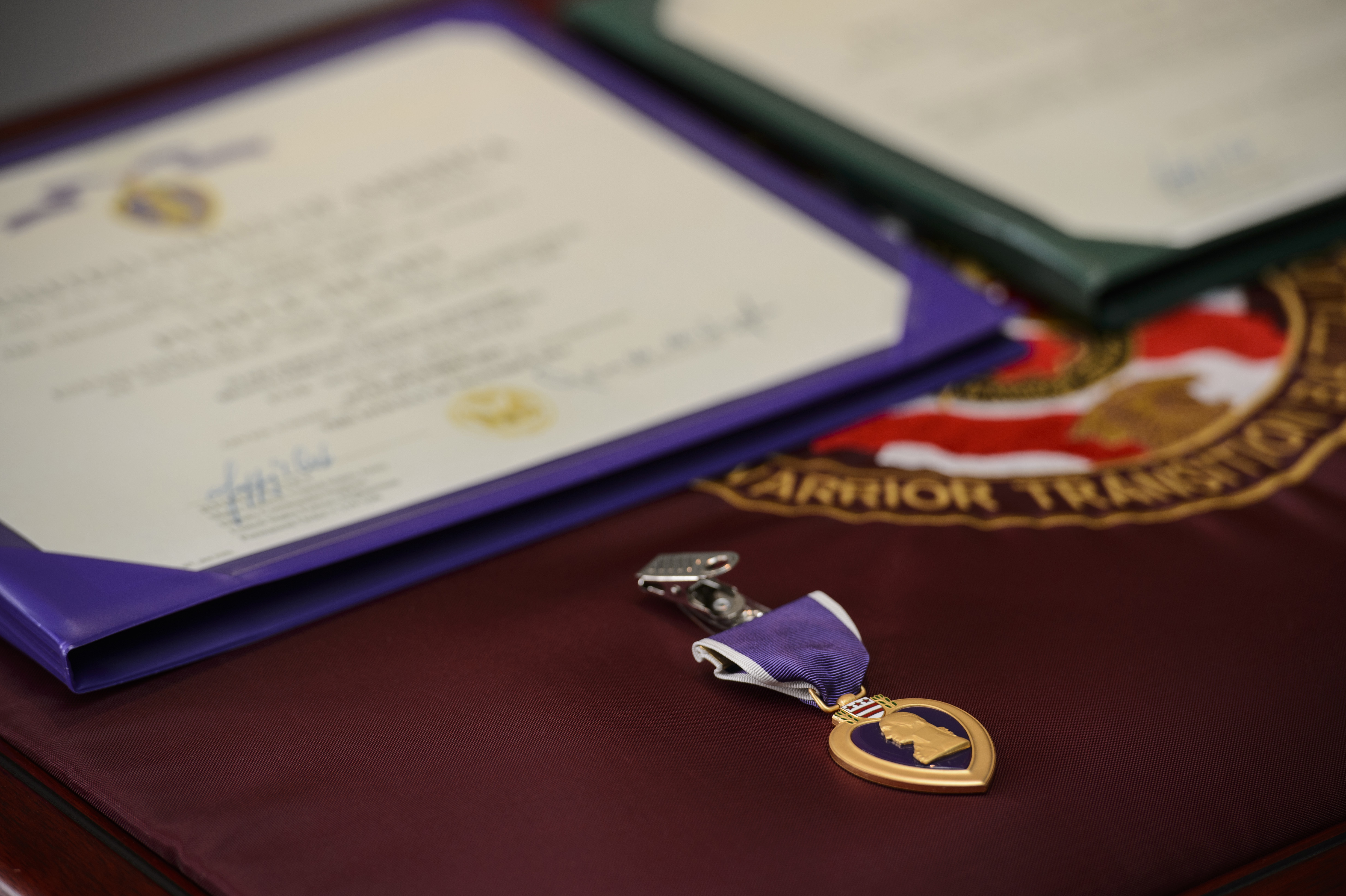 A Purple Heart medal lies on a table before a ceremony for Army Staff ...