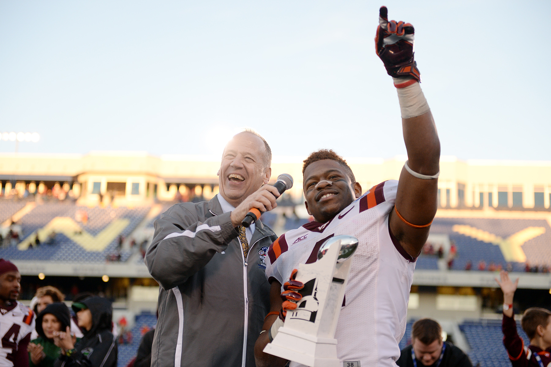 Virginia Tech’s J.C. Coleman accepts the Military Bowl 2014 MVP trophy after Virginia Tech’s 33 ...