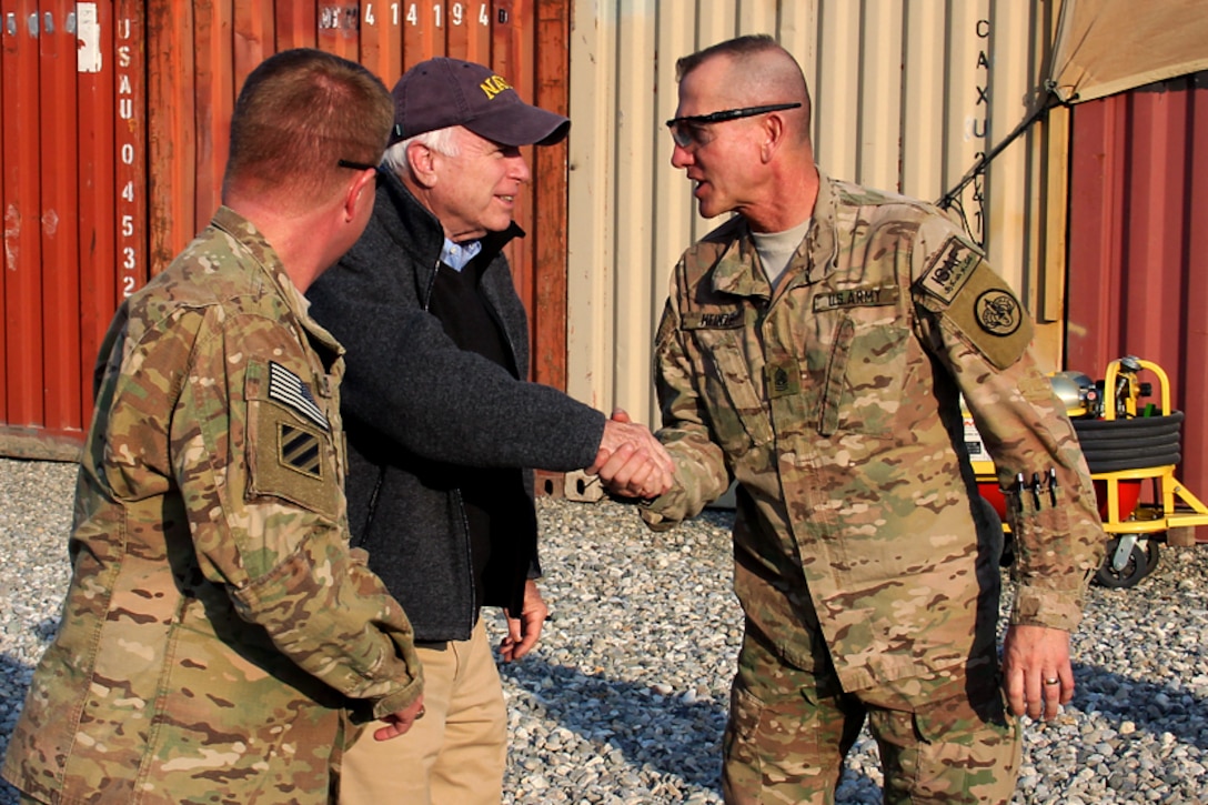 U.S. Army Brig. Gen. Christopher Bentley, left, commander of Train ...