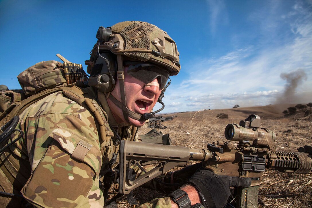 An Army Ranger yells commands to his squad during a live-fire training ...