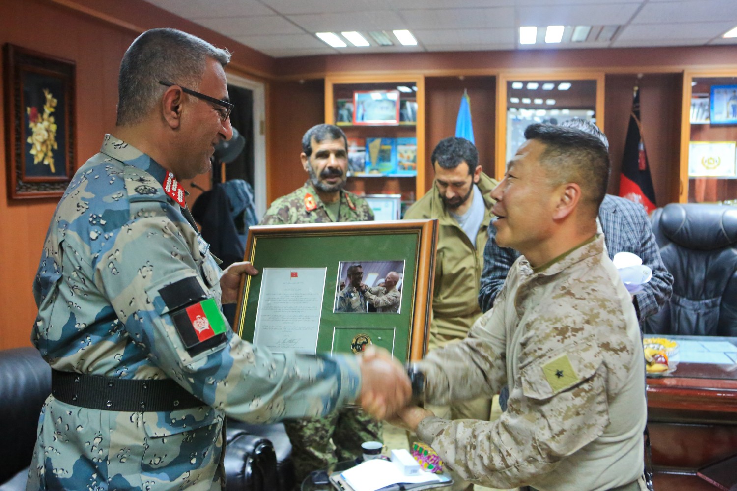 Brig. Gen. Yoo and Maj. Gen. Malook hold a Shura