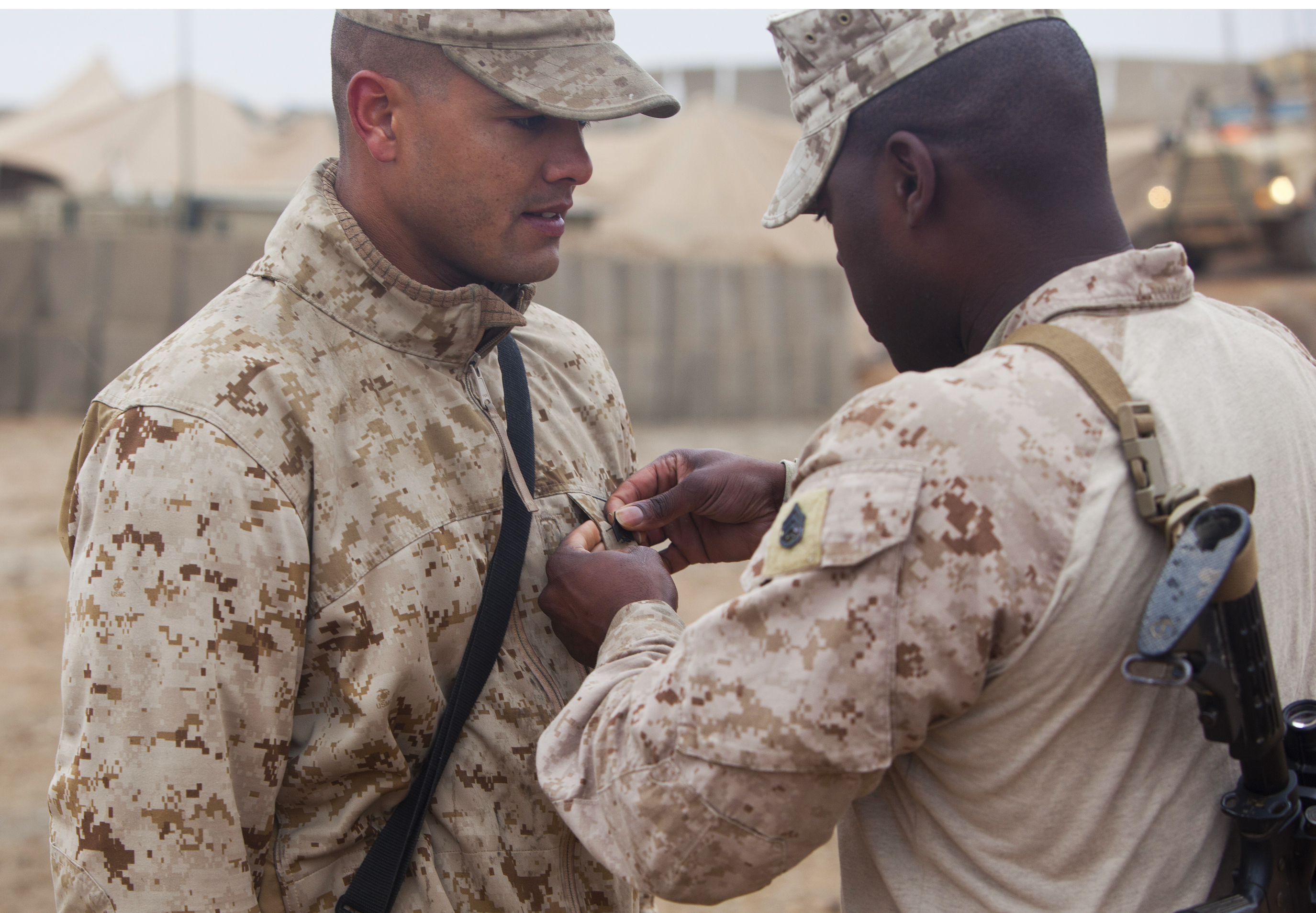 Marine Corps Sgt. Marcus Myers has his new rank pinned by Marine Corps ...