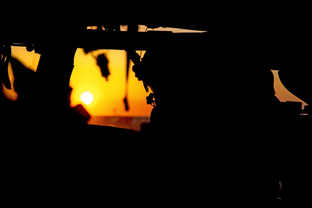 U.S. Army Capt. Mindy Wallace begins pre-flight checks before flying a ...